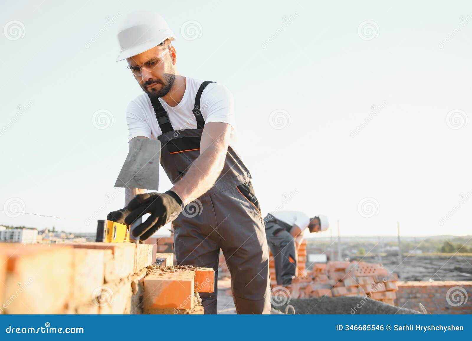Man Bricklayer Installing Bricks on Construction Site Stock Photo ...
