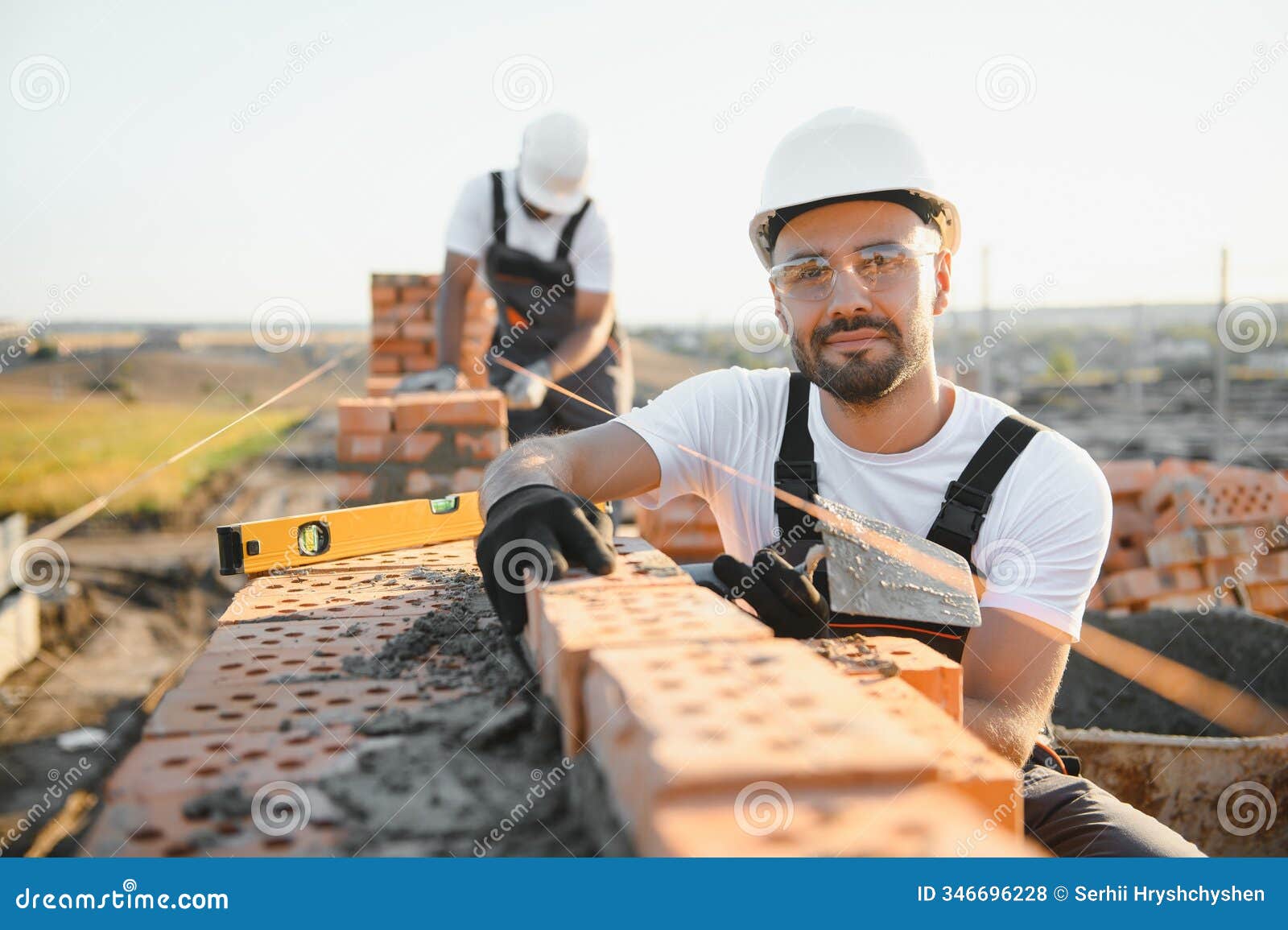 Man Bricklayer Installing Bricks on Construction Site Stock Photo ...