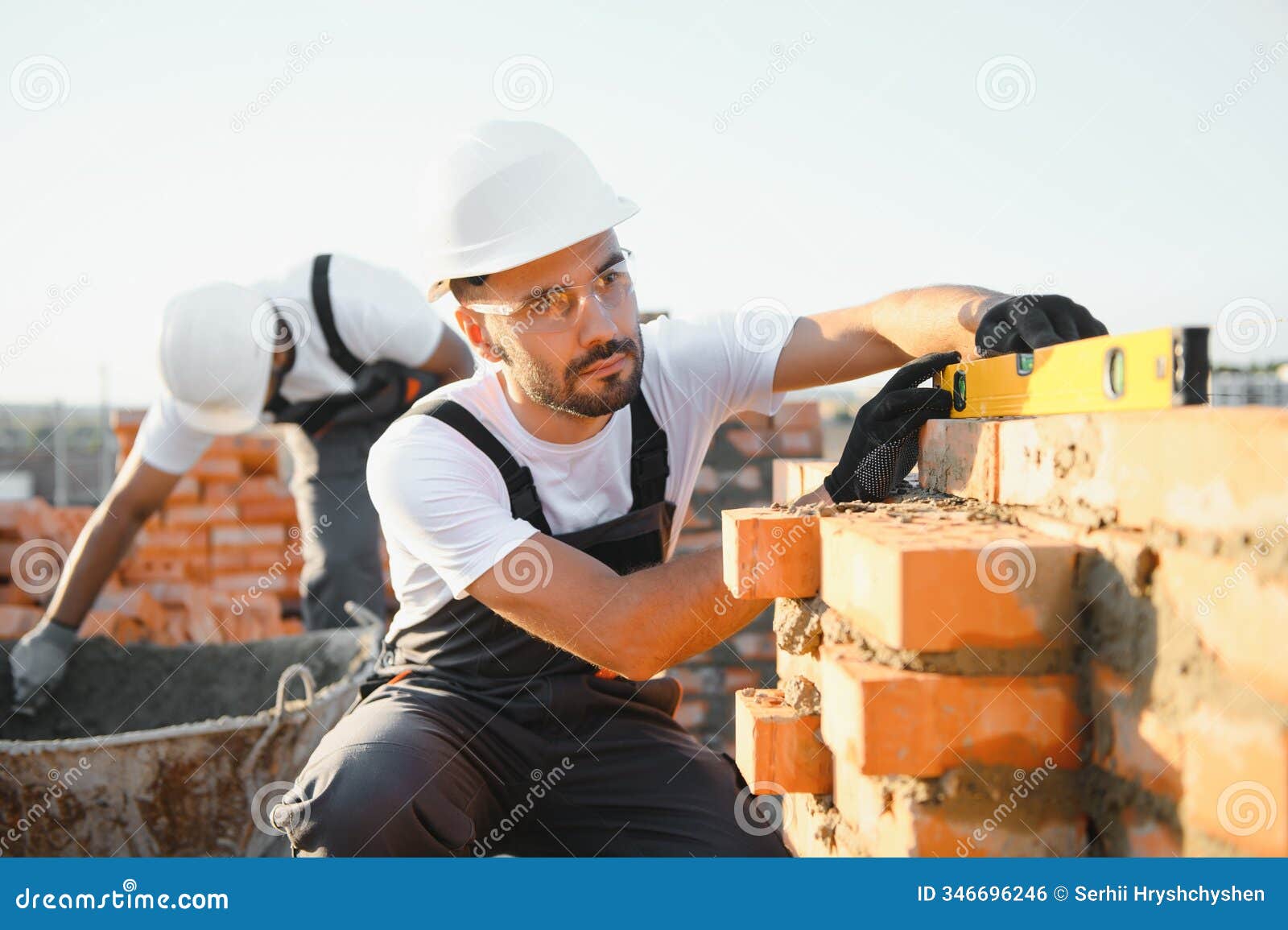 Man Bricklayer Installing Bricks on Construction Site Stock Photo ...
