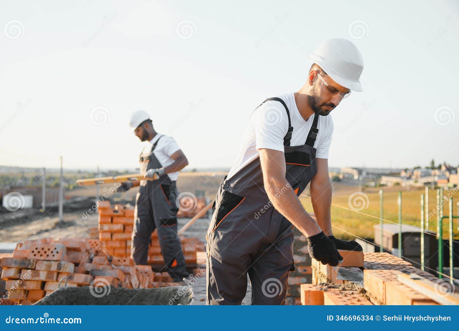 Man Bricklayer Installing Bricks on Construction Site Stock Photo ...