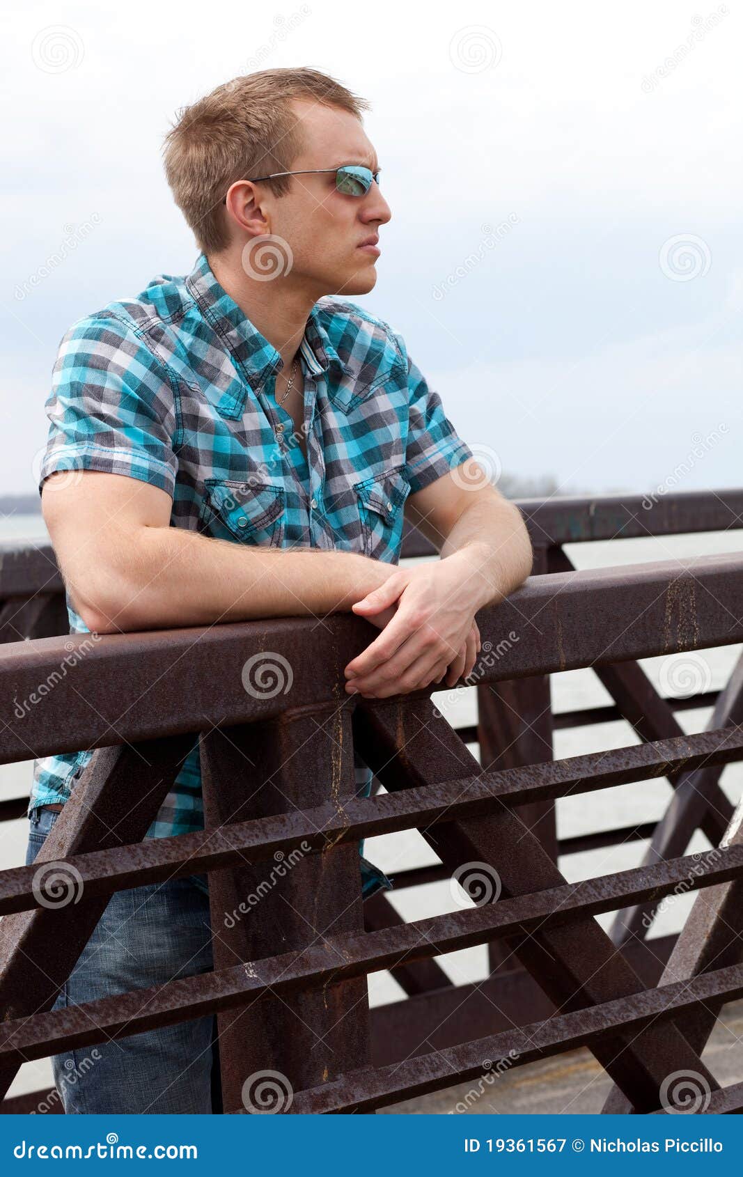 Man on Bridge stock image. Image of park, railing, blue - 19361567