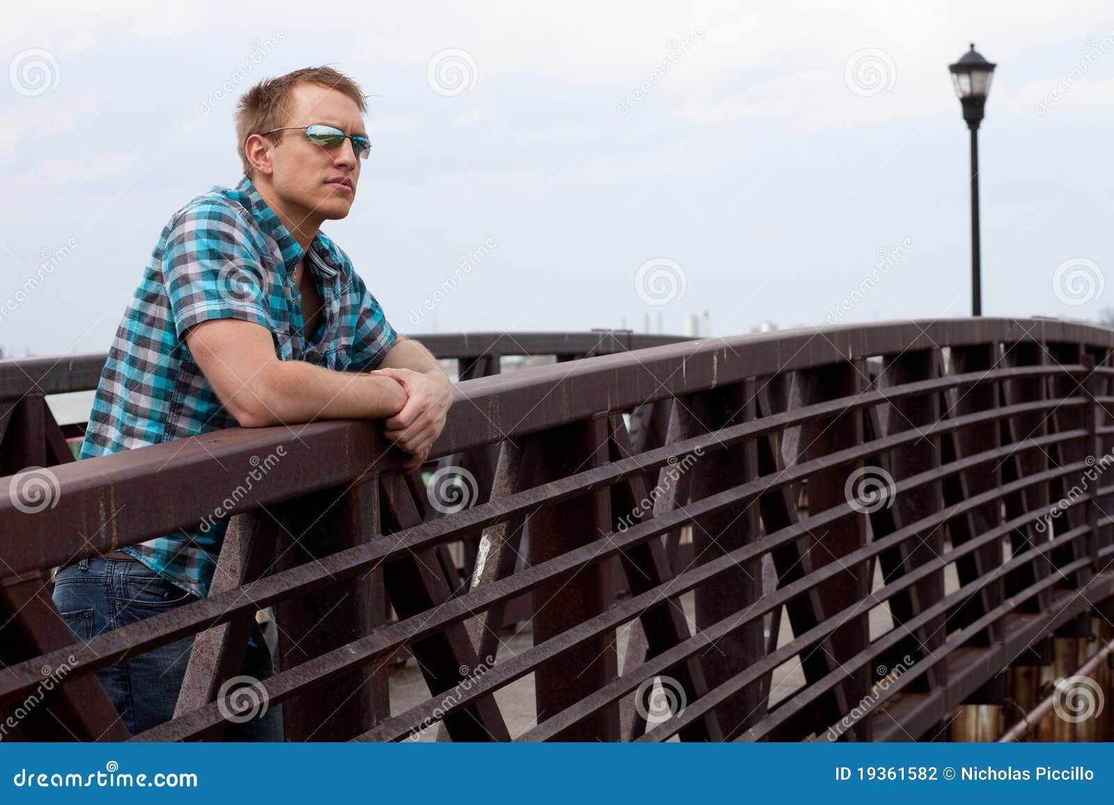 Man on Bridge stock photo. Image of jeans, standing, young - 19361582
