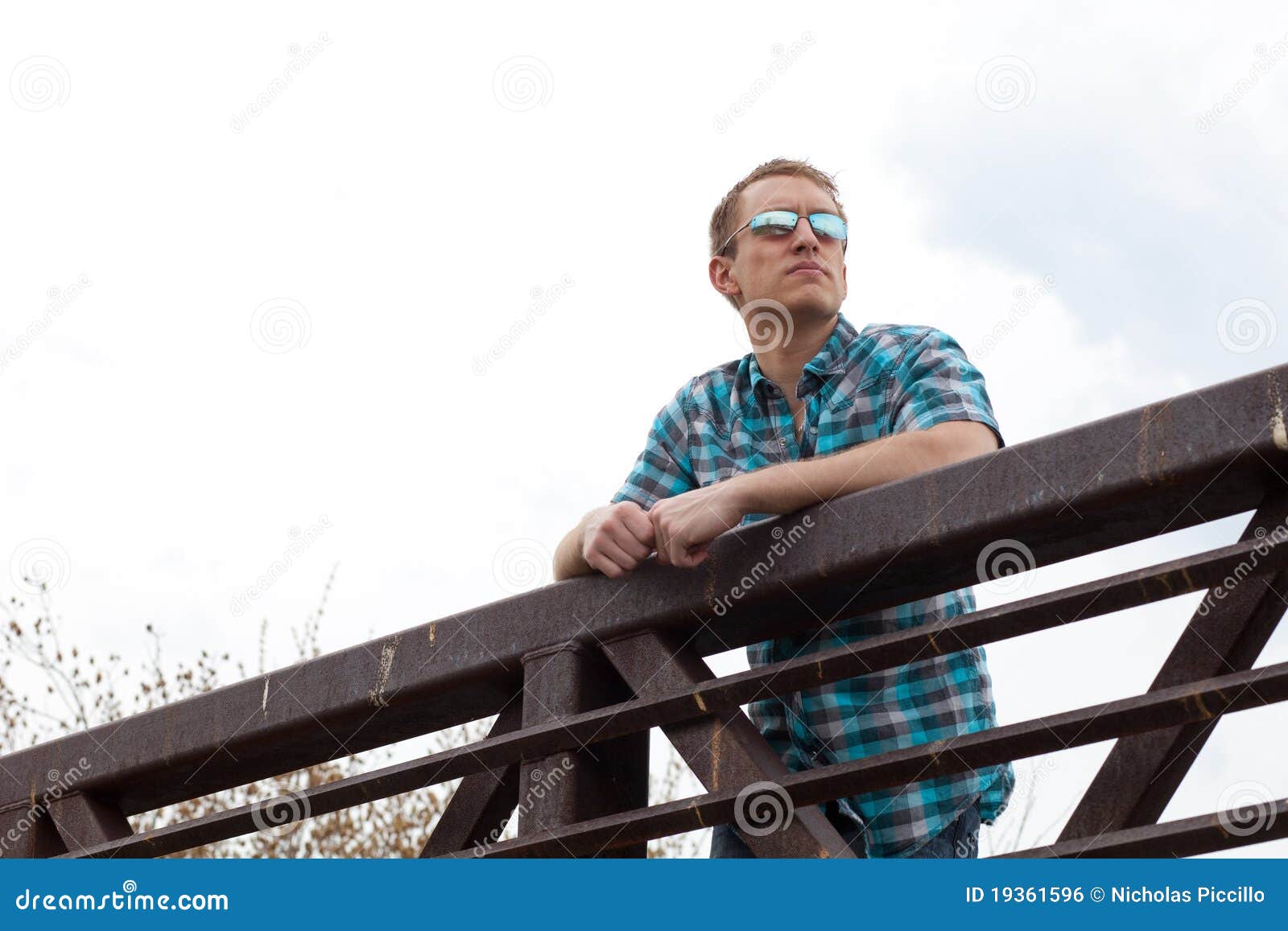 Man on Bridge stock photo. Image of cloudy, bridge, young - 19361596