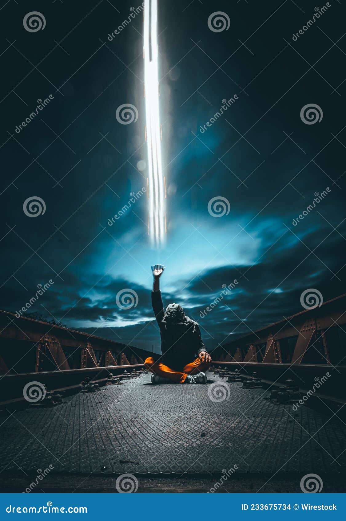 Man on the Bridge Sending Magical Power To Heaven at Night Stock Photo ...
