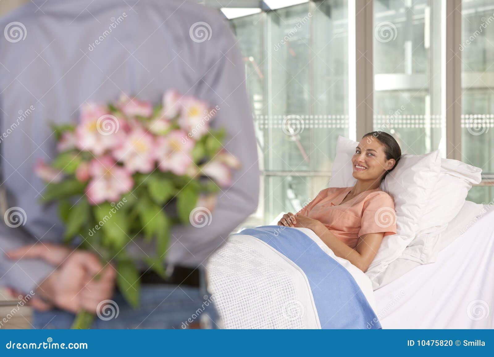Man Bringing Flowers To Patient Stock Photo - Image of sitting ...