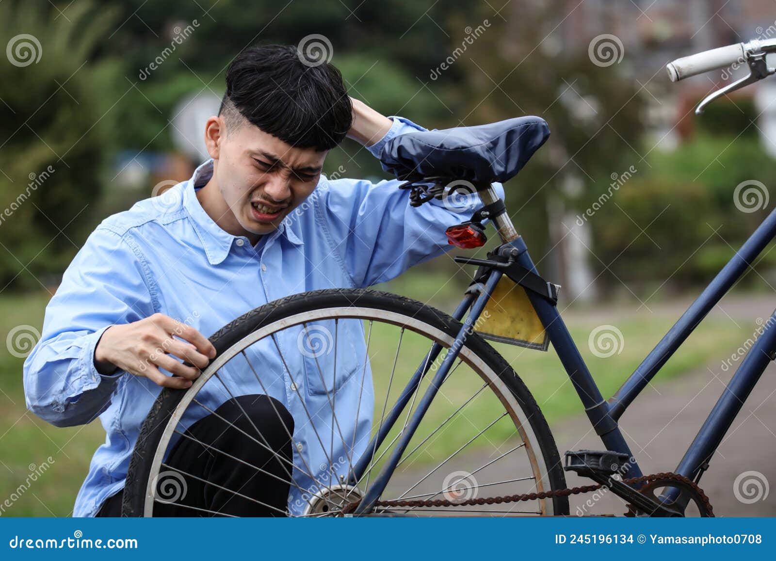 A Man with a Broken Bicycle Stock Photo - Image of person, worried ...