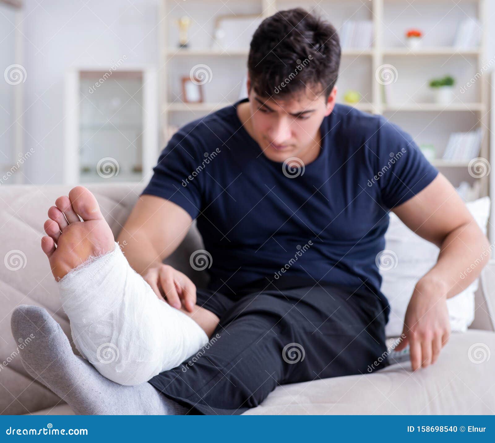 Man with Broken Leg Recovering at Home Stock Photo - Image of couch ...