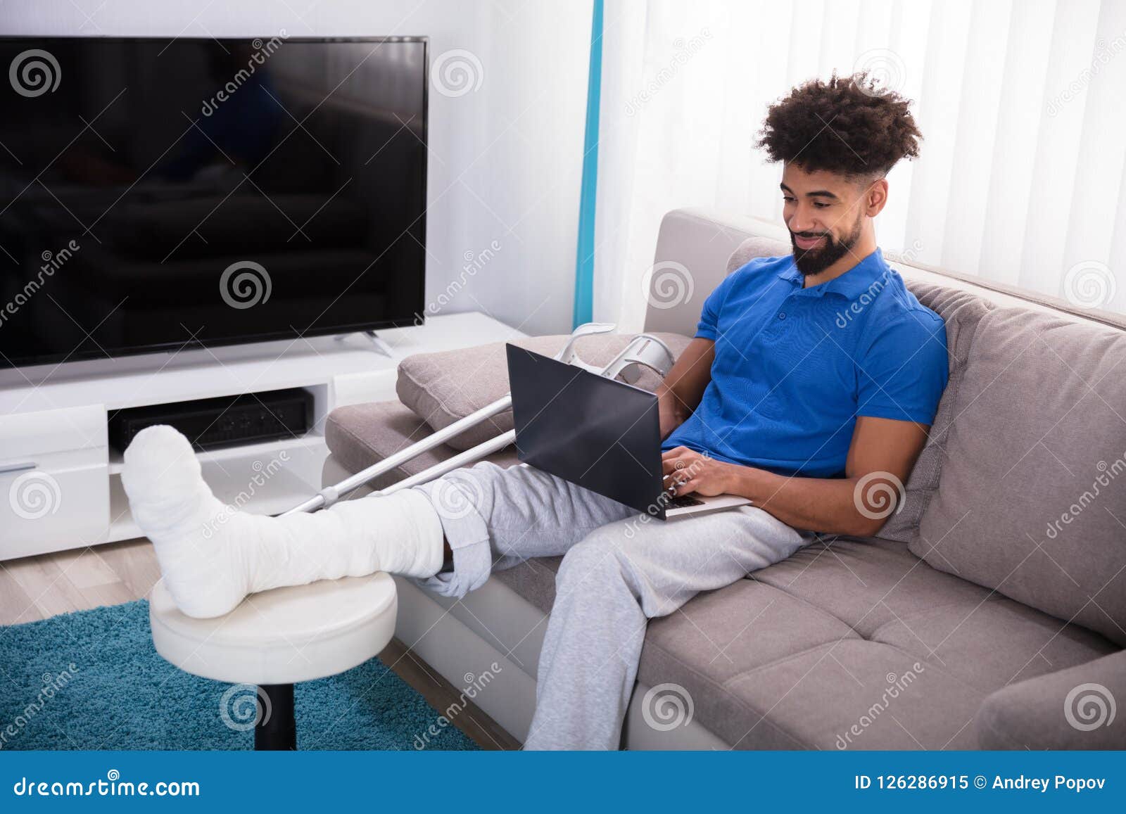 Man with Broken Leg Using Laptop Stock Image - Image of handicapped ...