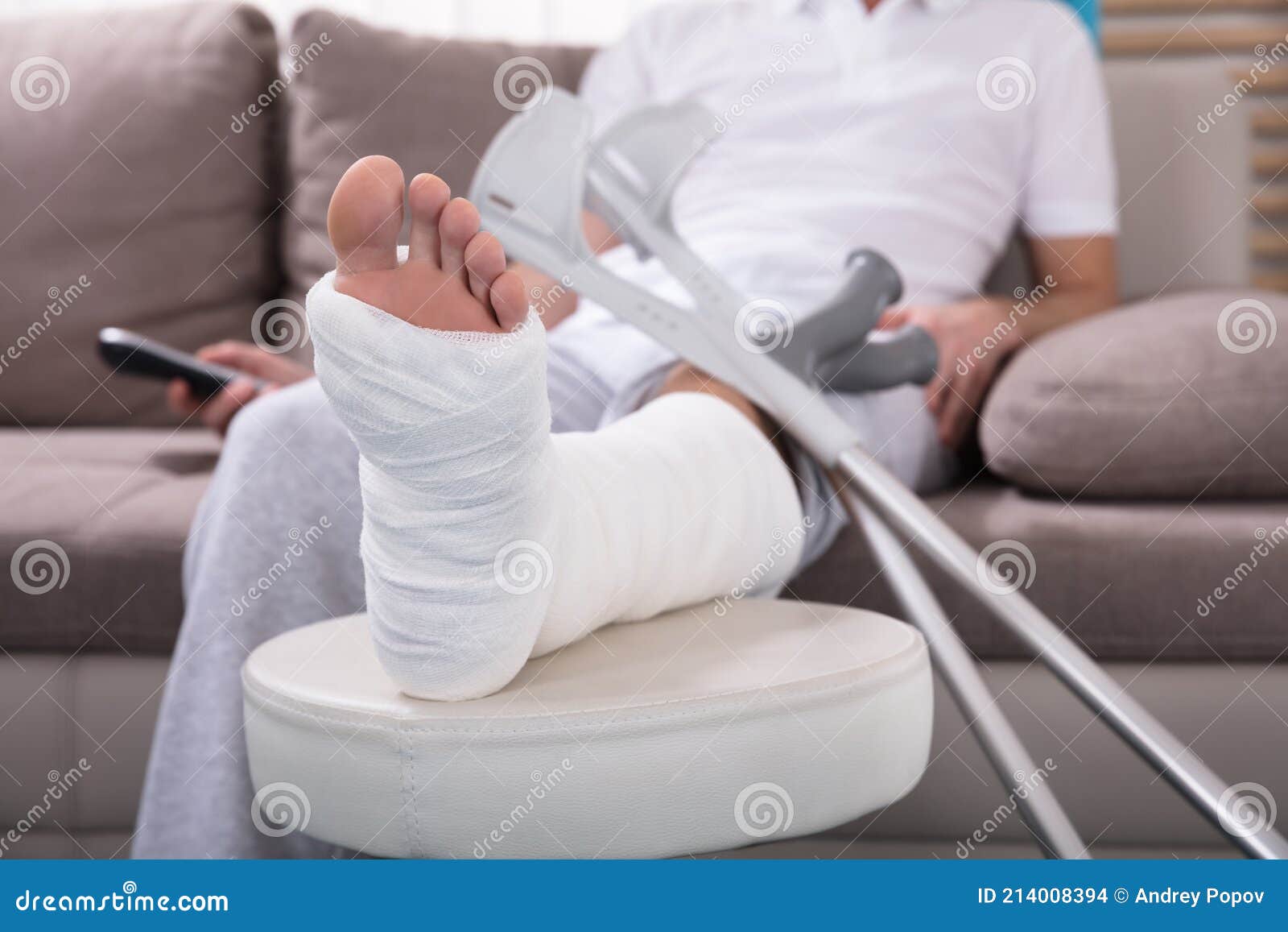 Man with Broken Leg Sitting on Sofa Stock Photo - Image of inside ...