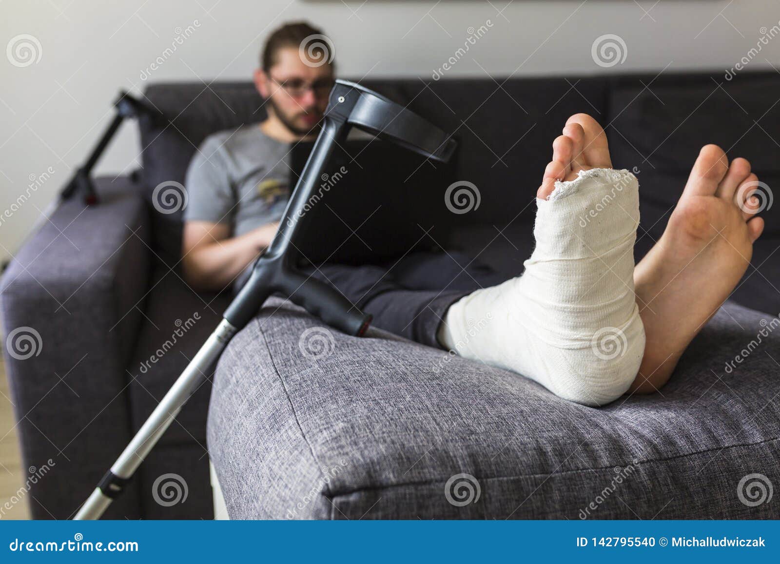 Man with a Broken Leg is Surfing the Internet Stock Photo - Image of ...