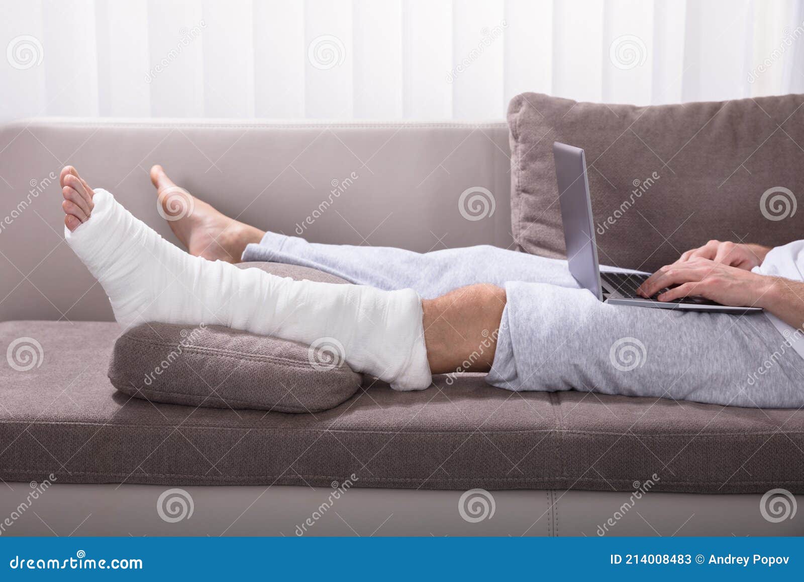 Man with Broken Leg Using Laptop Stock Image - Image of feet, domestic ...
