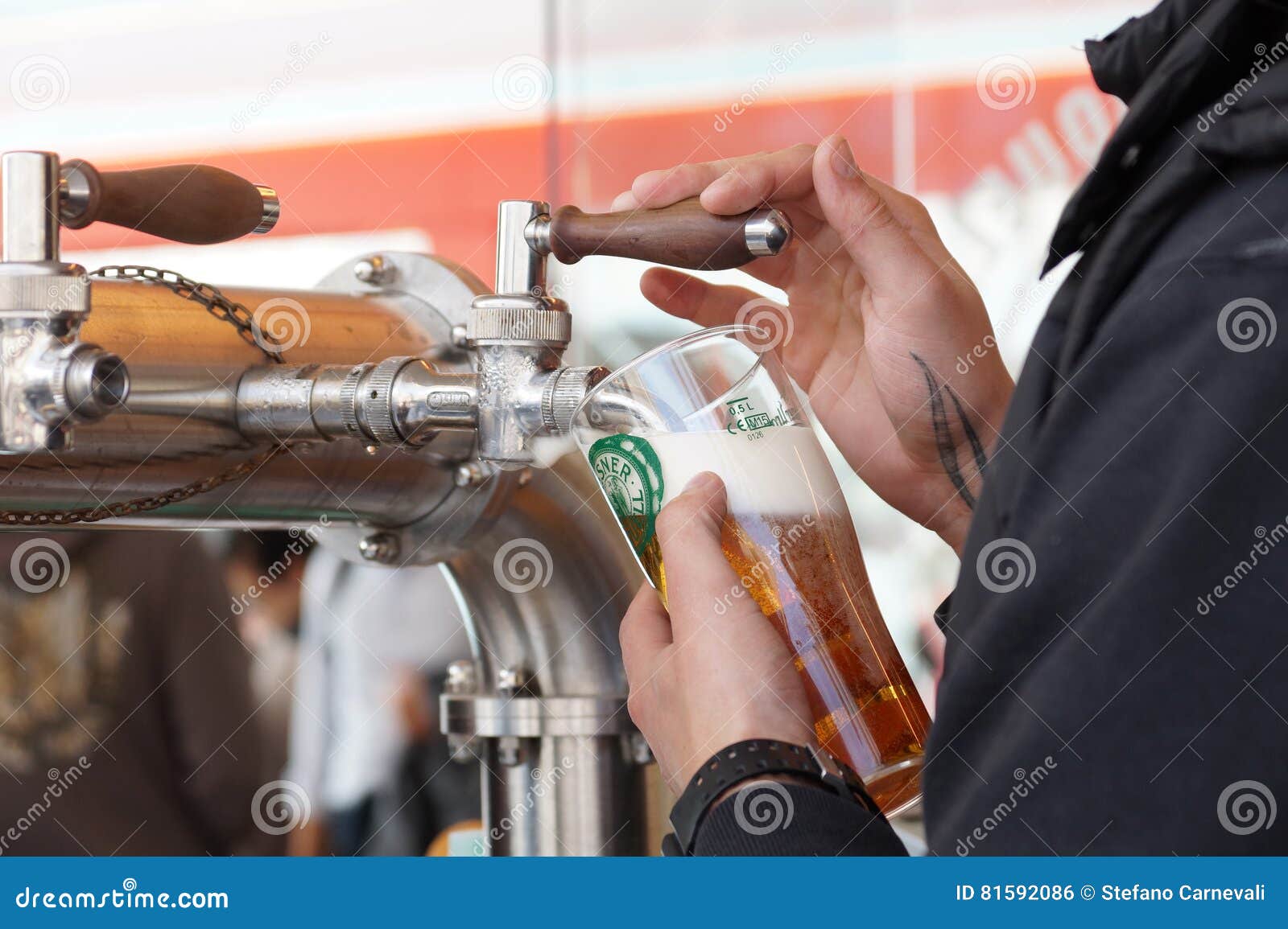 Man Brooch Draft Beer during Demonstration. is an Alcoholic Beverage ...