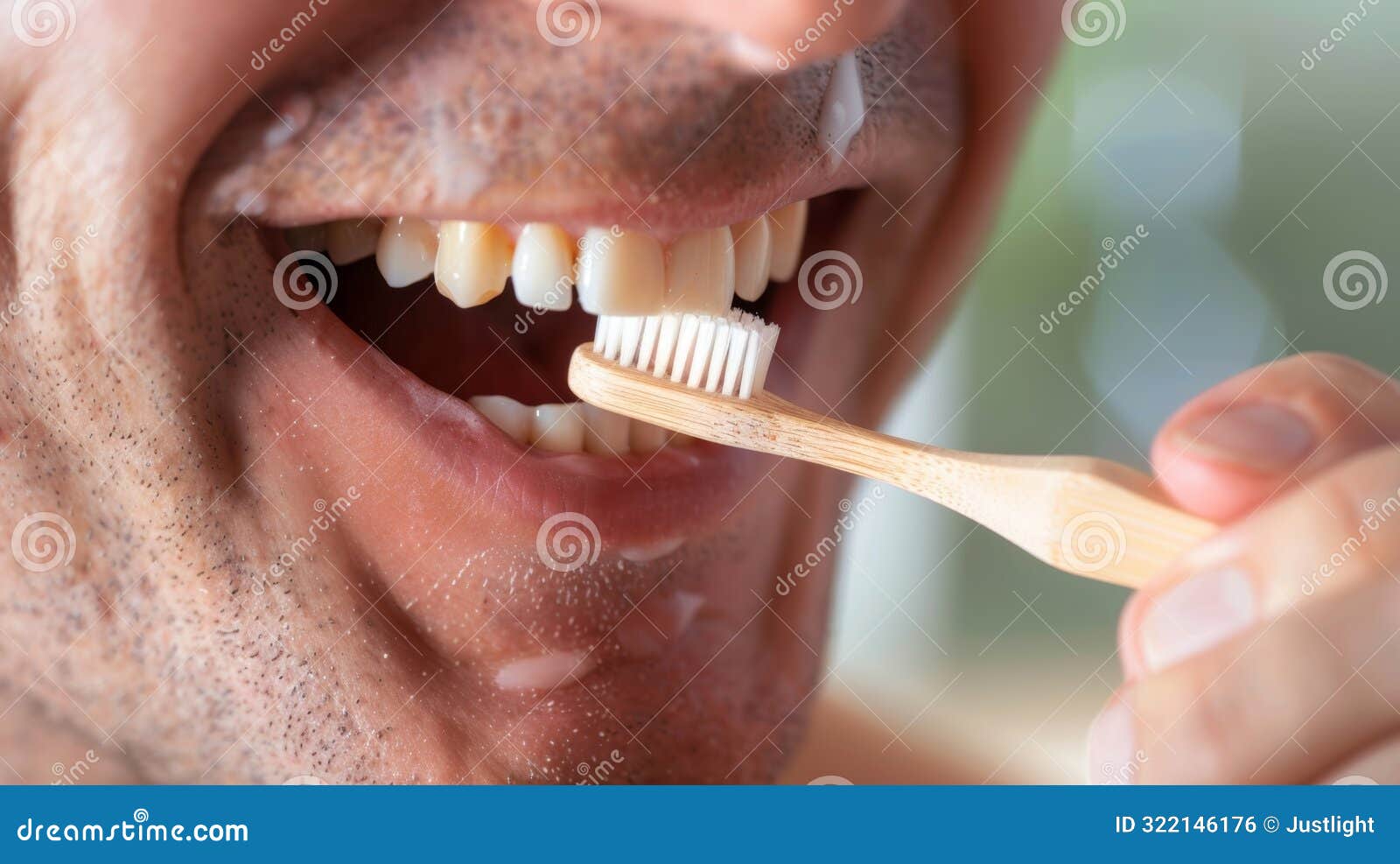 A Man Brushing His Teeth with a Bamboo Toothbrush Taking a Step Towards ...