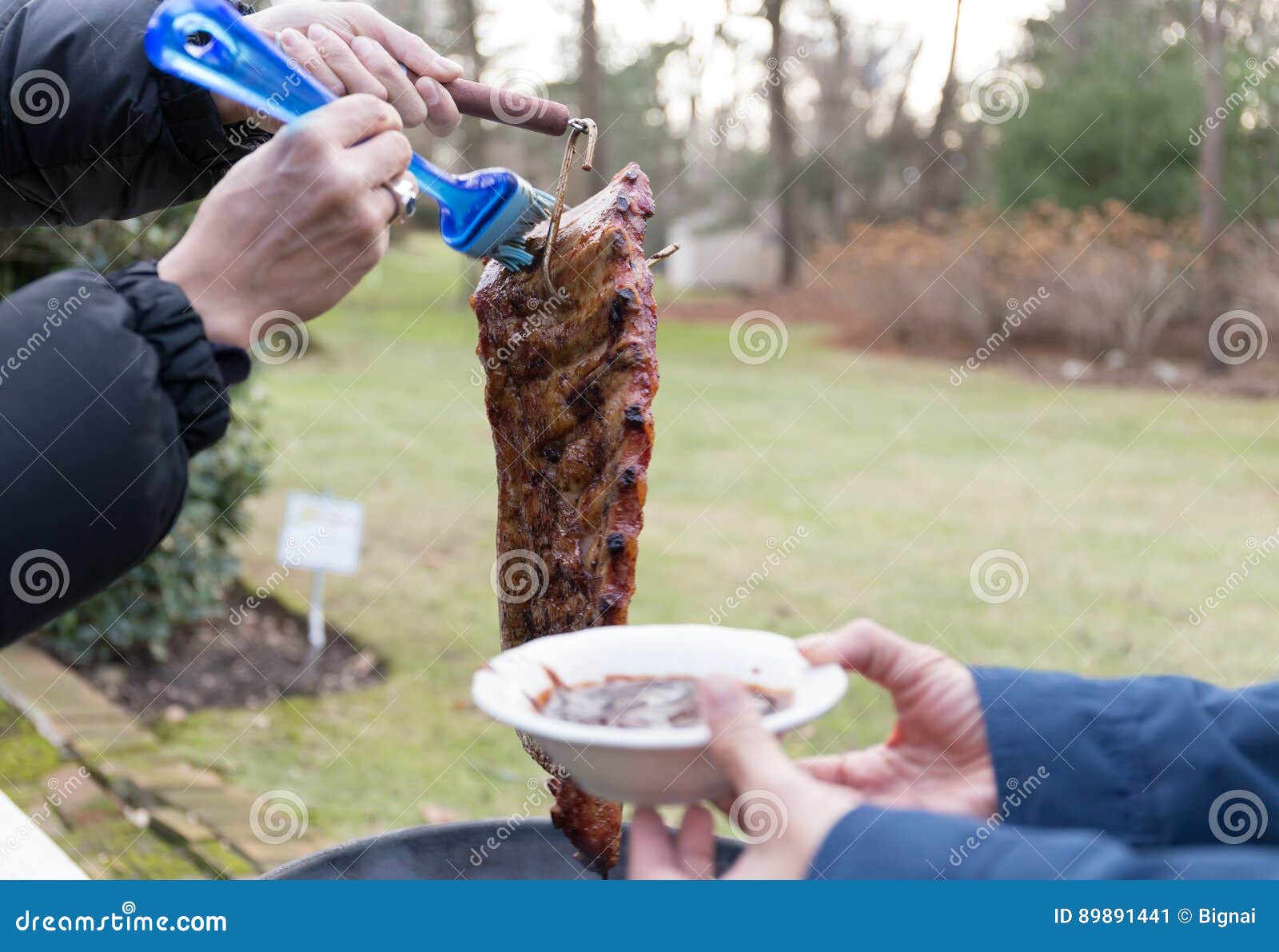 Man Brushing Sauce on Barbecue Spare Ribs Stock Image - Image of ...