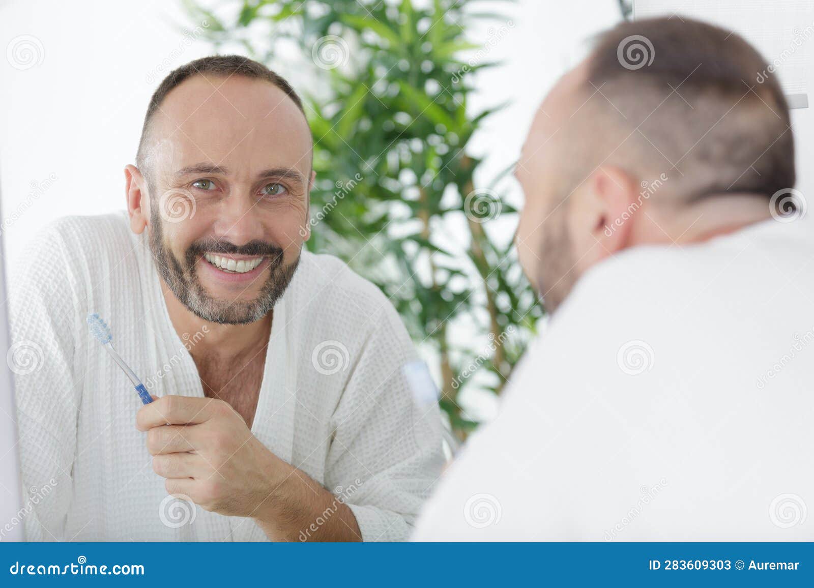 Man brushing teeth stock image. Image of face, background - 283609303