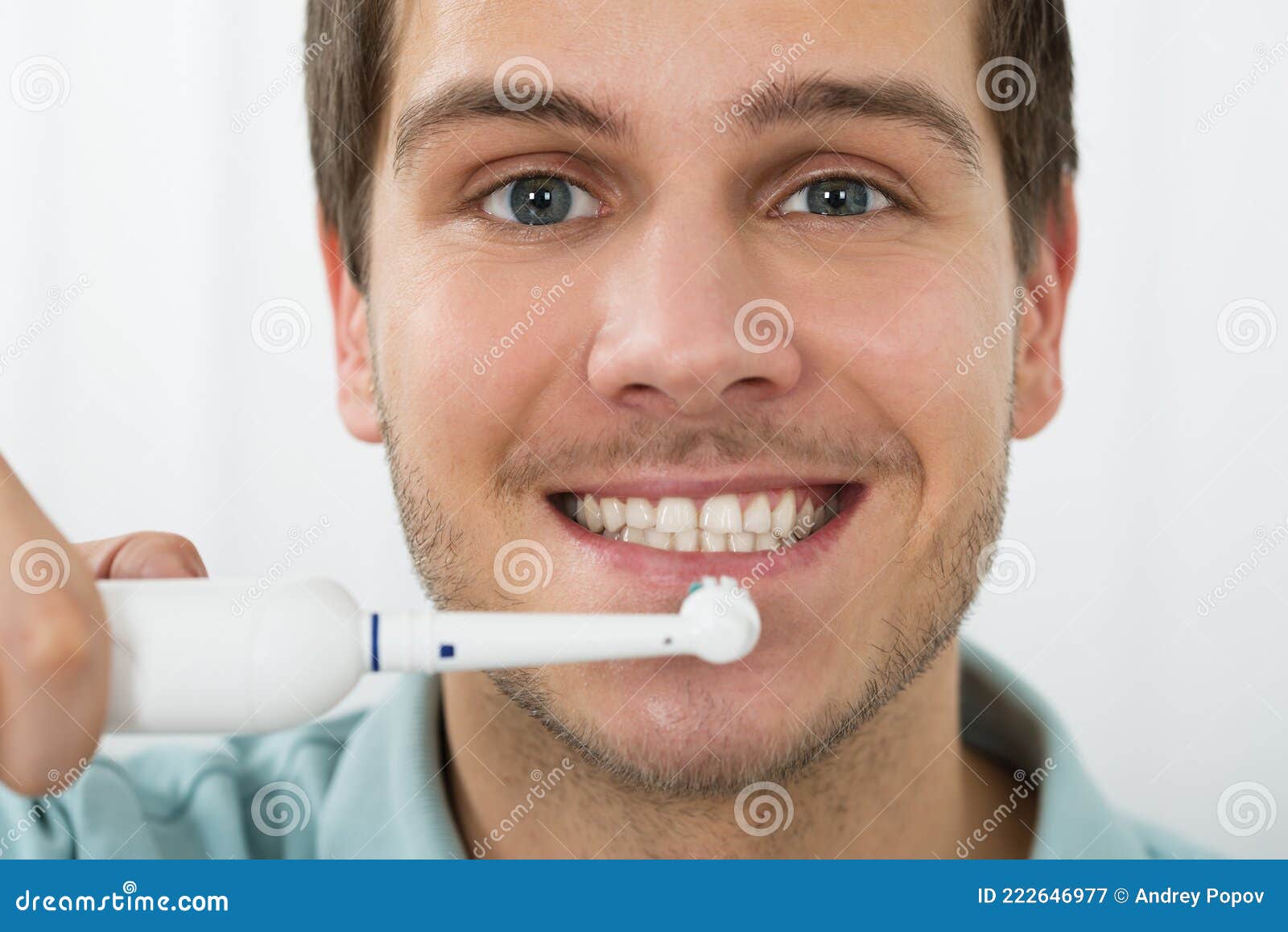 Man Brushing Teeth with Electric Toothbrush Stock Image - Image of ...