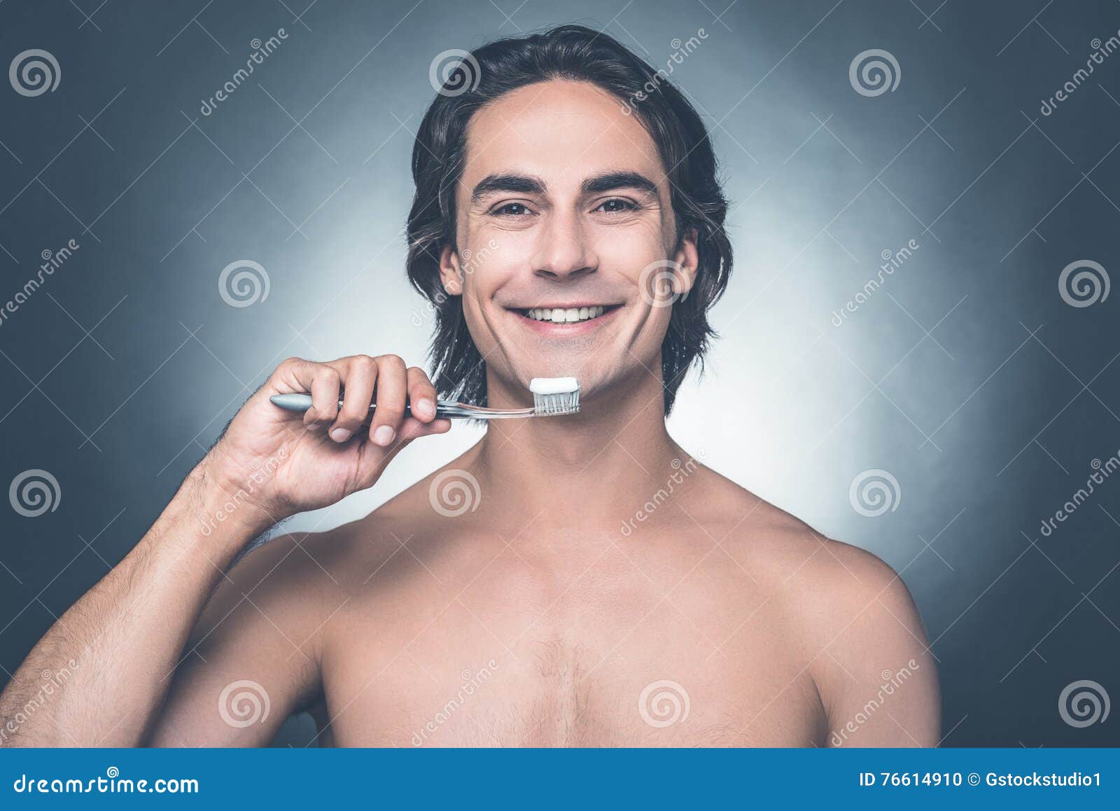 Man brushing teeth. stock photo. Image of beautiful, brushing - 76614910