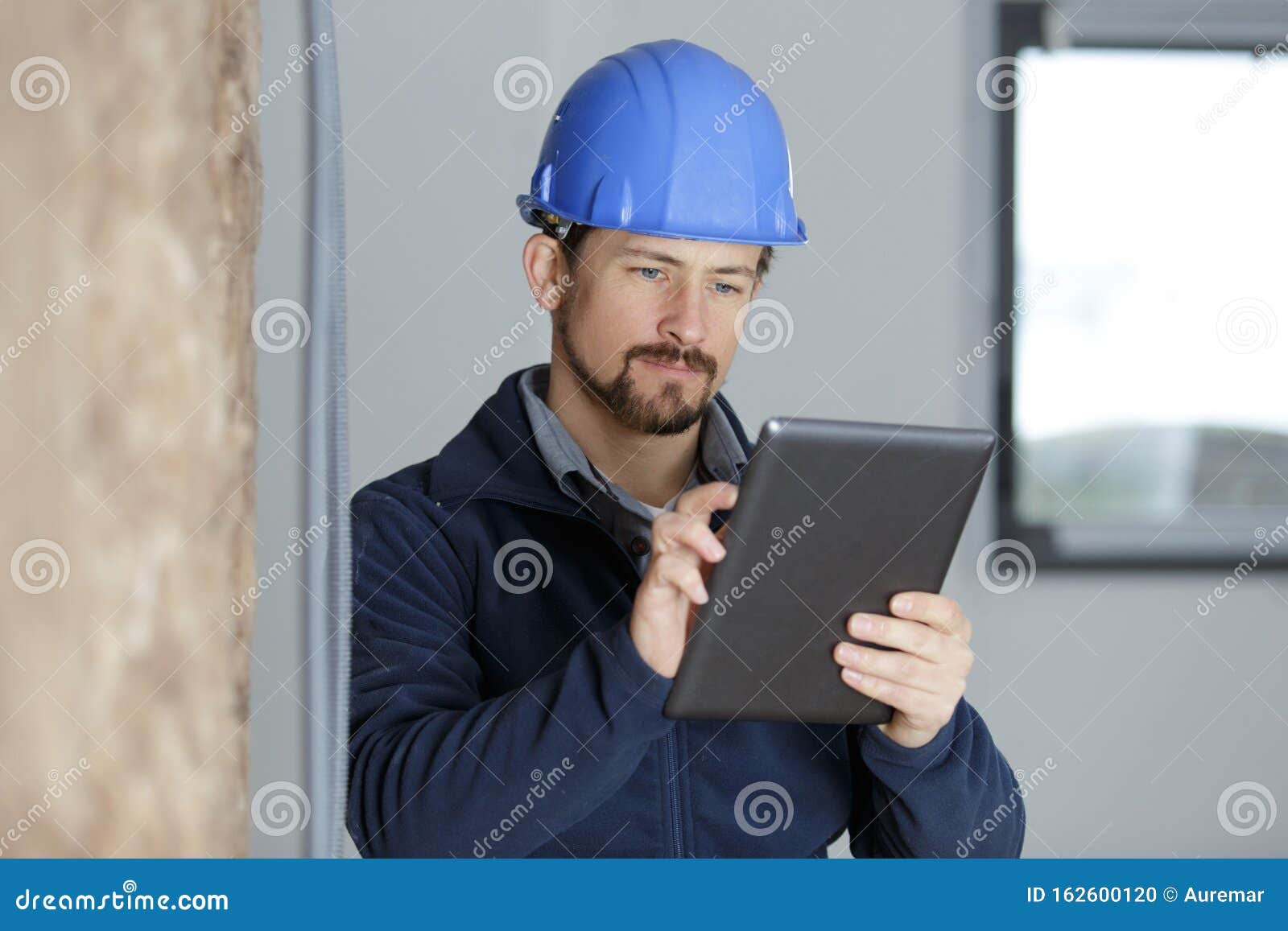 Man Builde Uses Tablet in Site Stock Photo - Image of builder, roofer ...