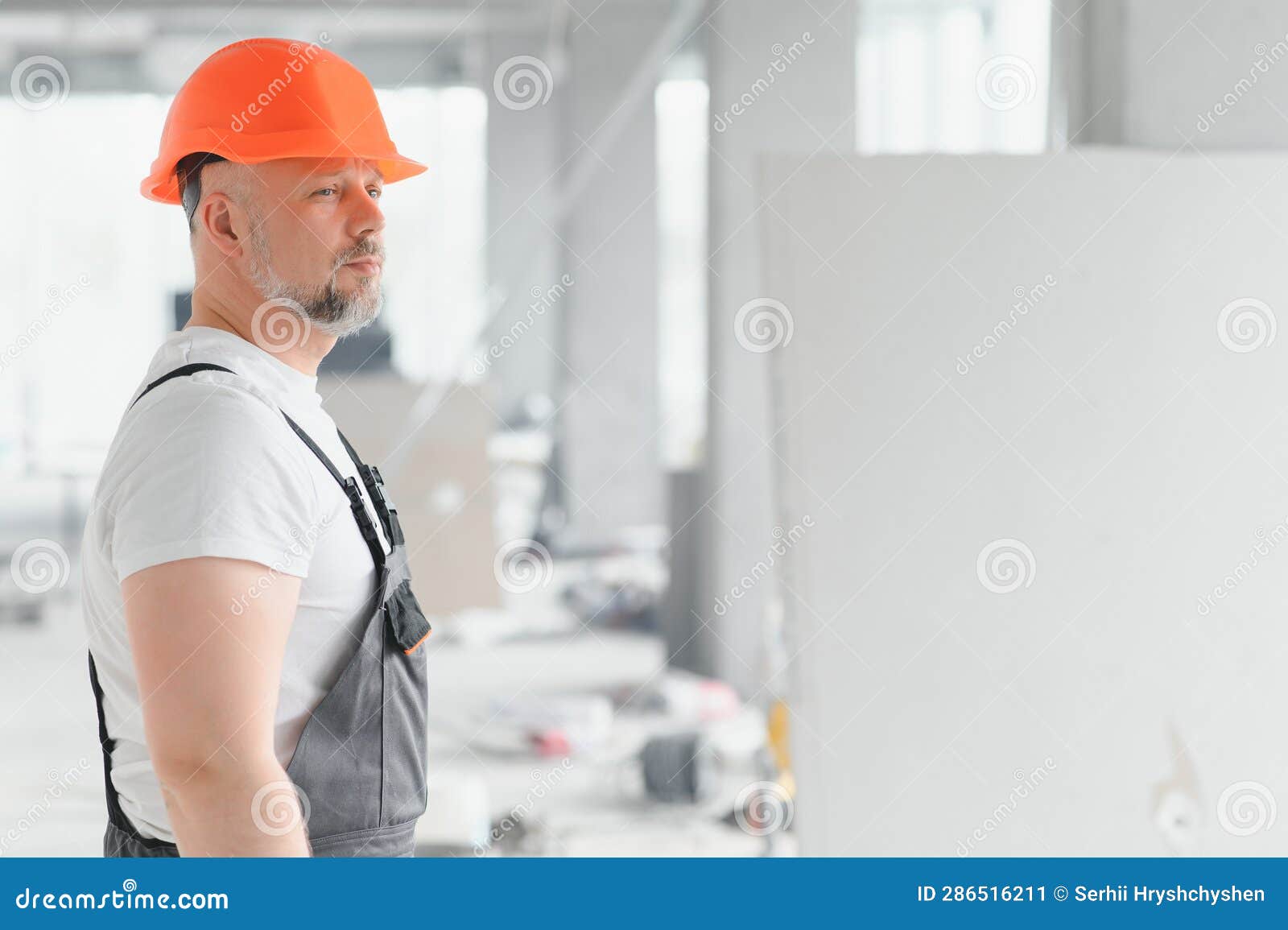 Man Builder. Architect is Standing in Building. Portrait of Thinking ...