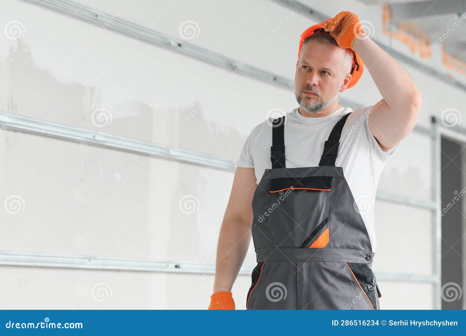 Man Builder. Architect is Standing in Building. Portrait of Thinking ...