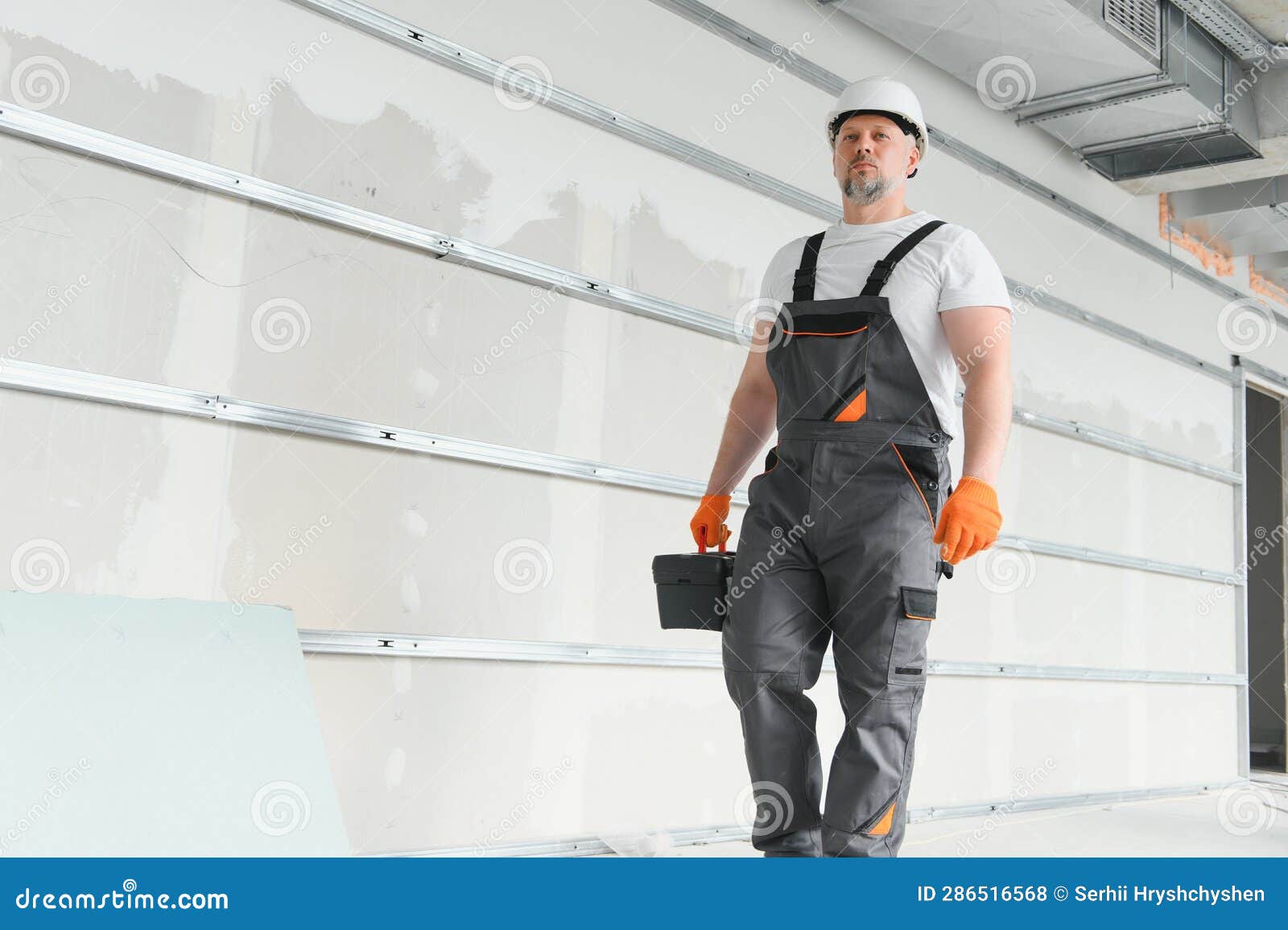 Man Builder. Architect is Standing in Building. Portrait of Thinking ...