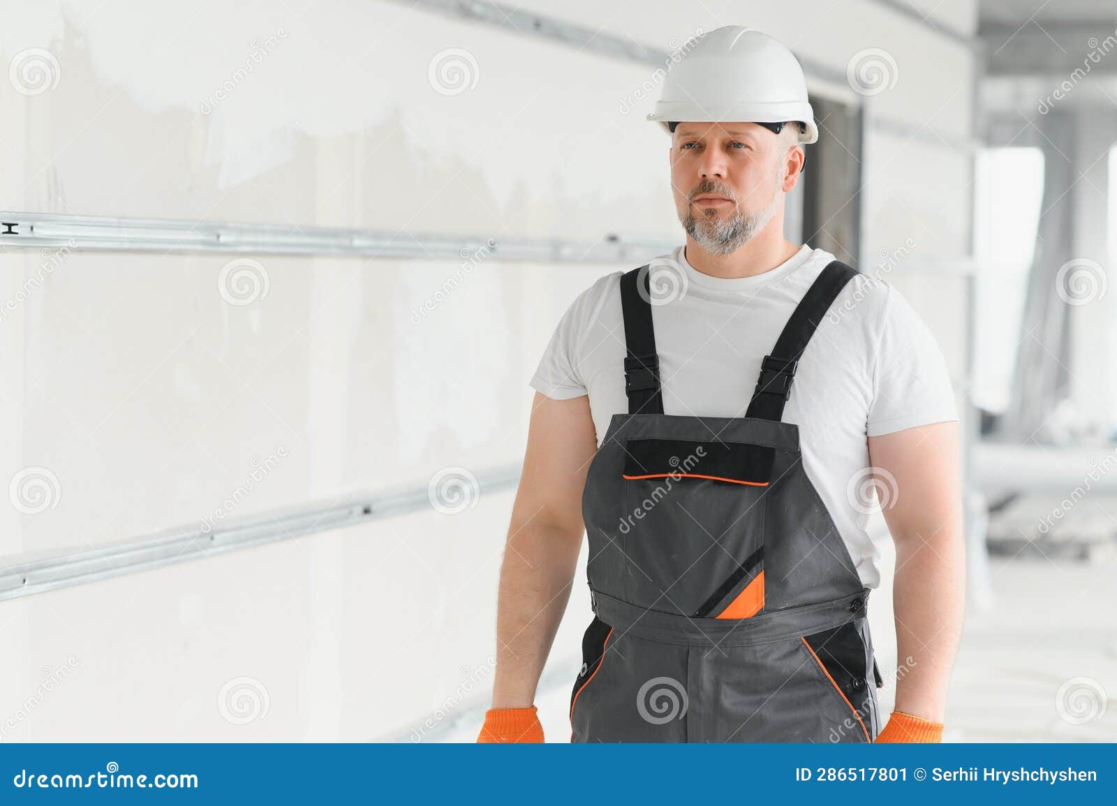 Man Builder. Architect is Standing in Building. Portrait of Thinking ...