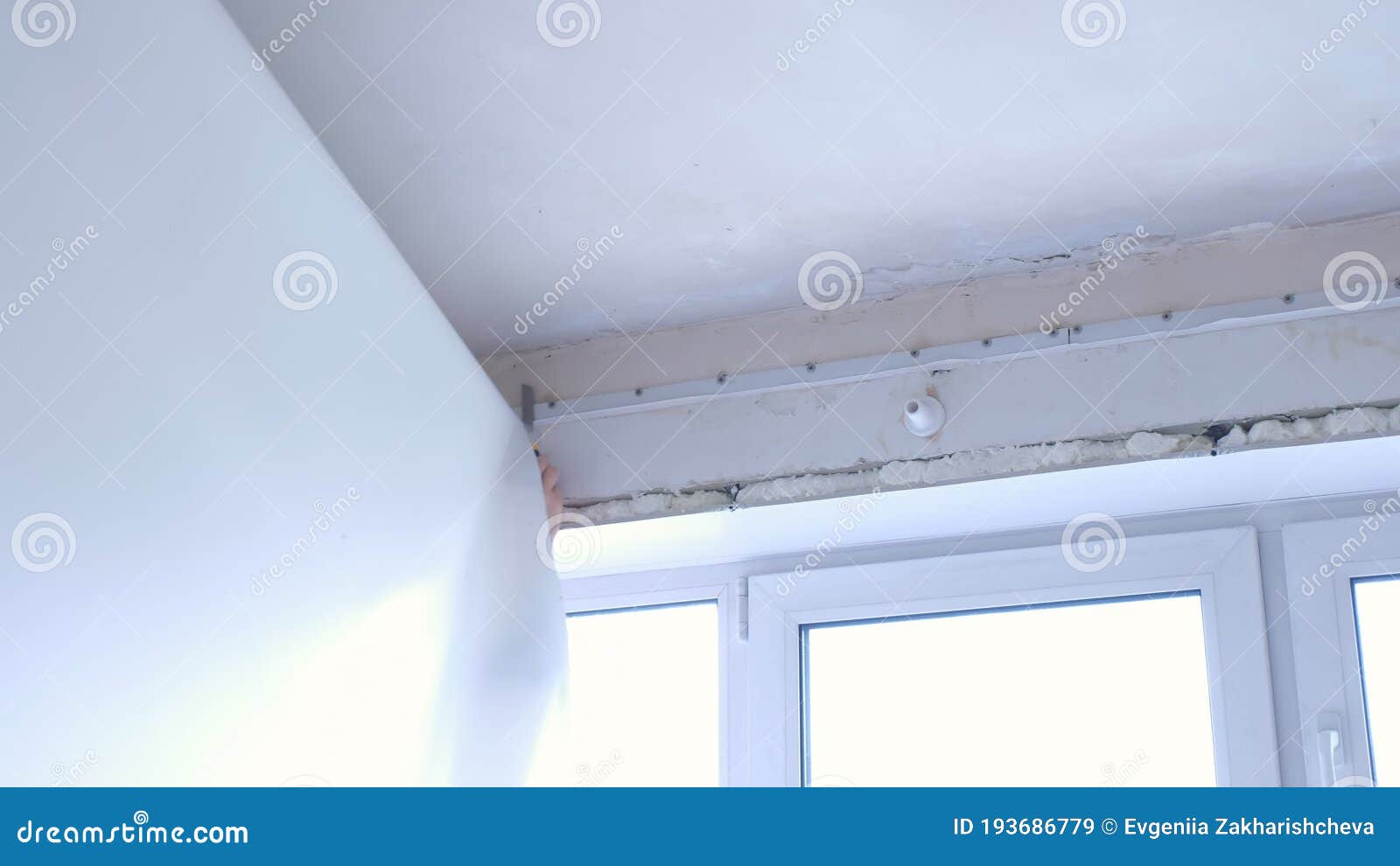 Man Builder Making Demontage of Stretch Suspended Ceiling Cuts it Using ...