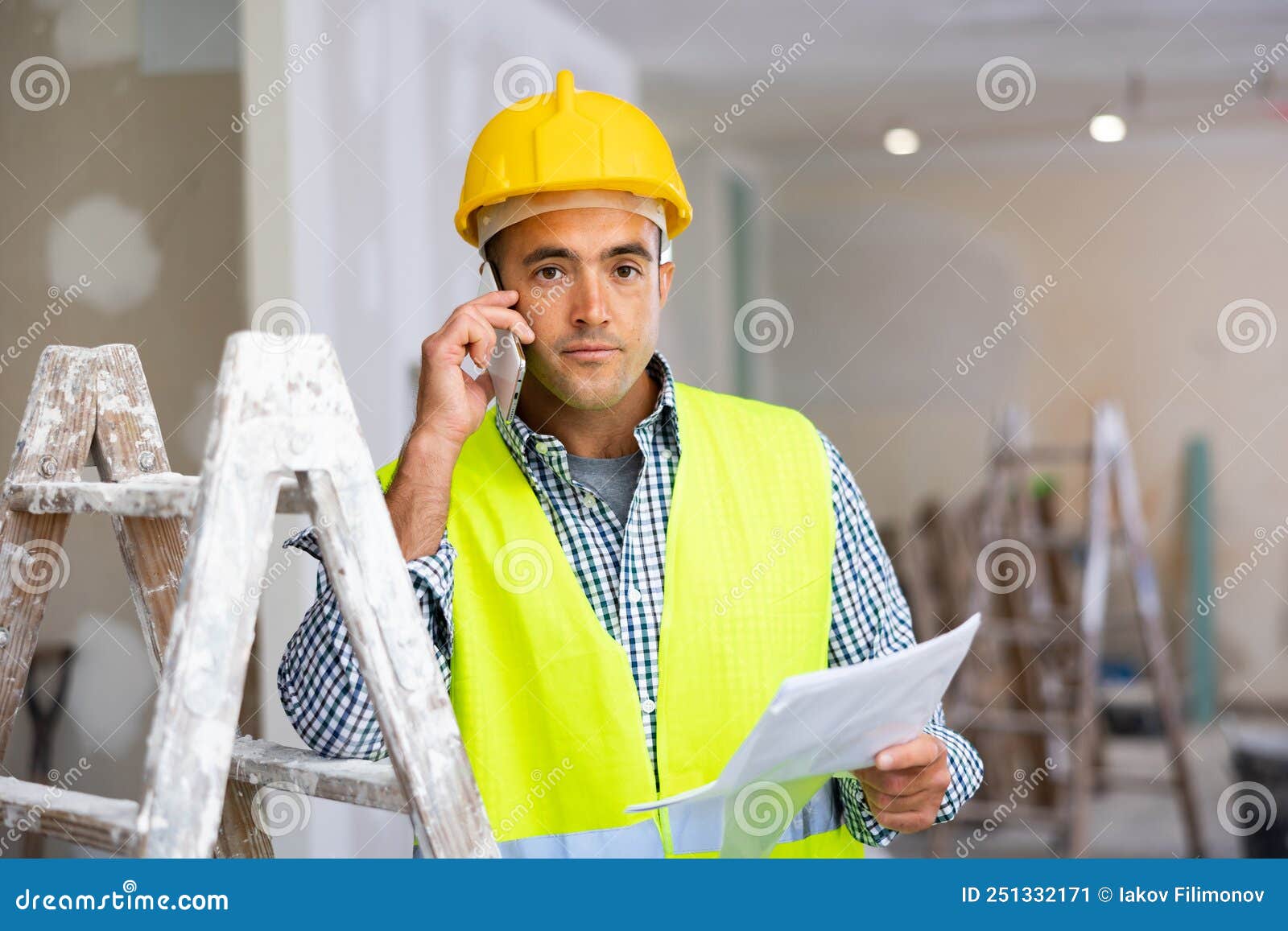 Man Builder Having Telephone Conversation in Construction Site Stock ...