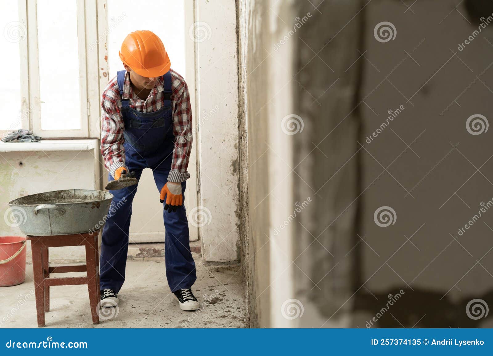 Man Builder Plasterer Using Trowel To Plastering Cement Wall in Home ...