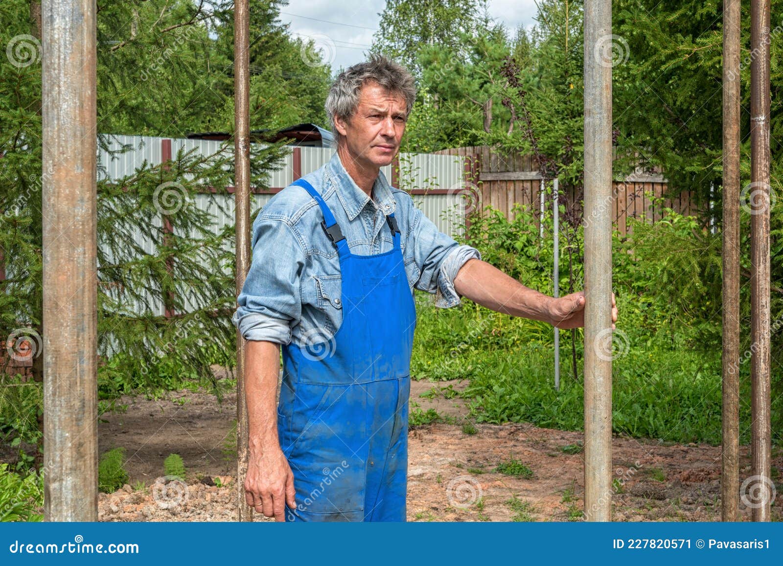 Man is a Builder on a Real Construction Site in Nature. Construction of ...