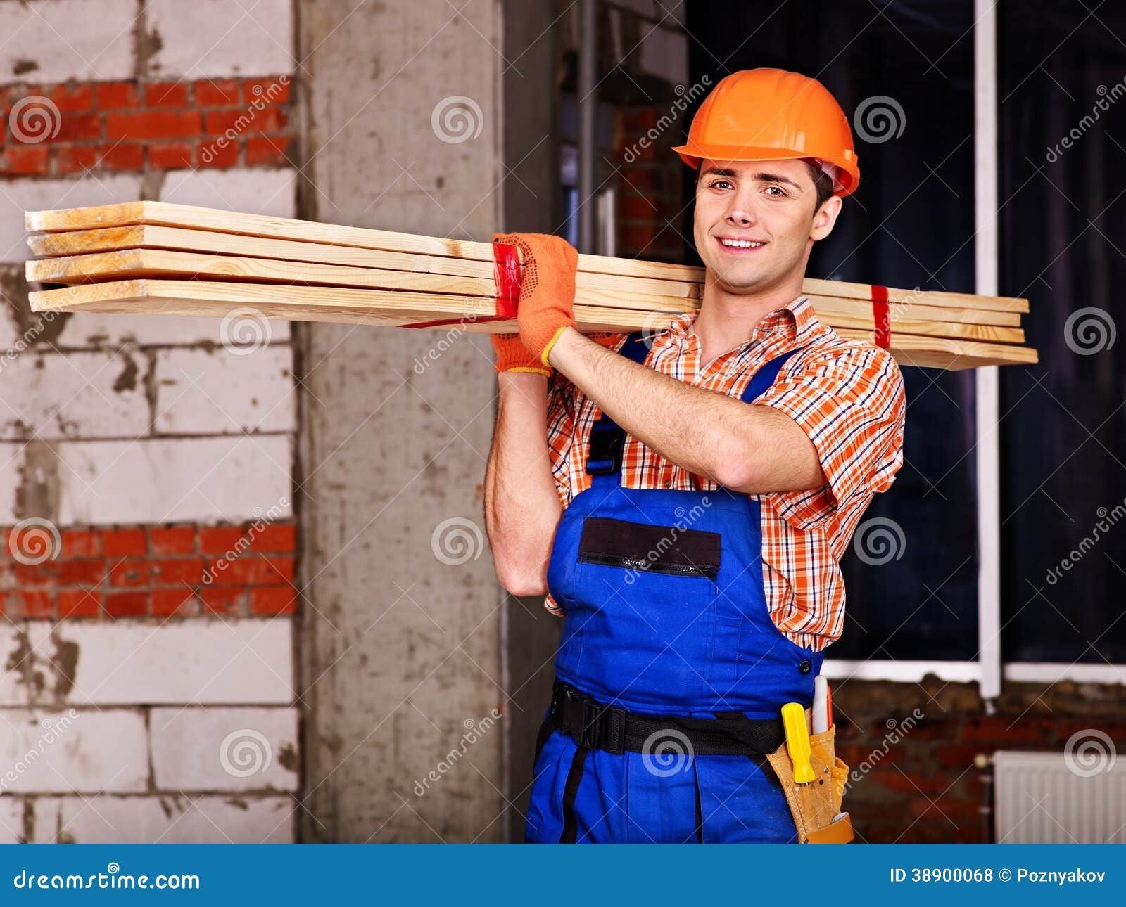 Man in builder uniform. stock photo. Image of planking - 38900068