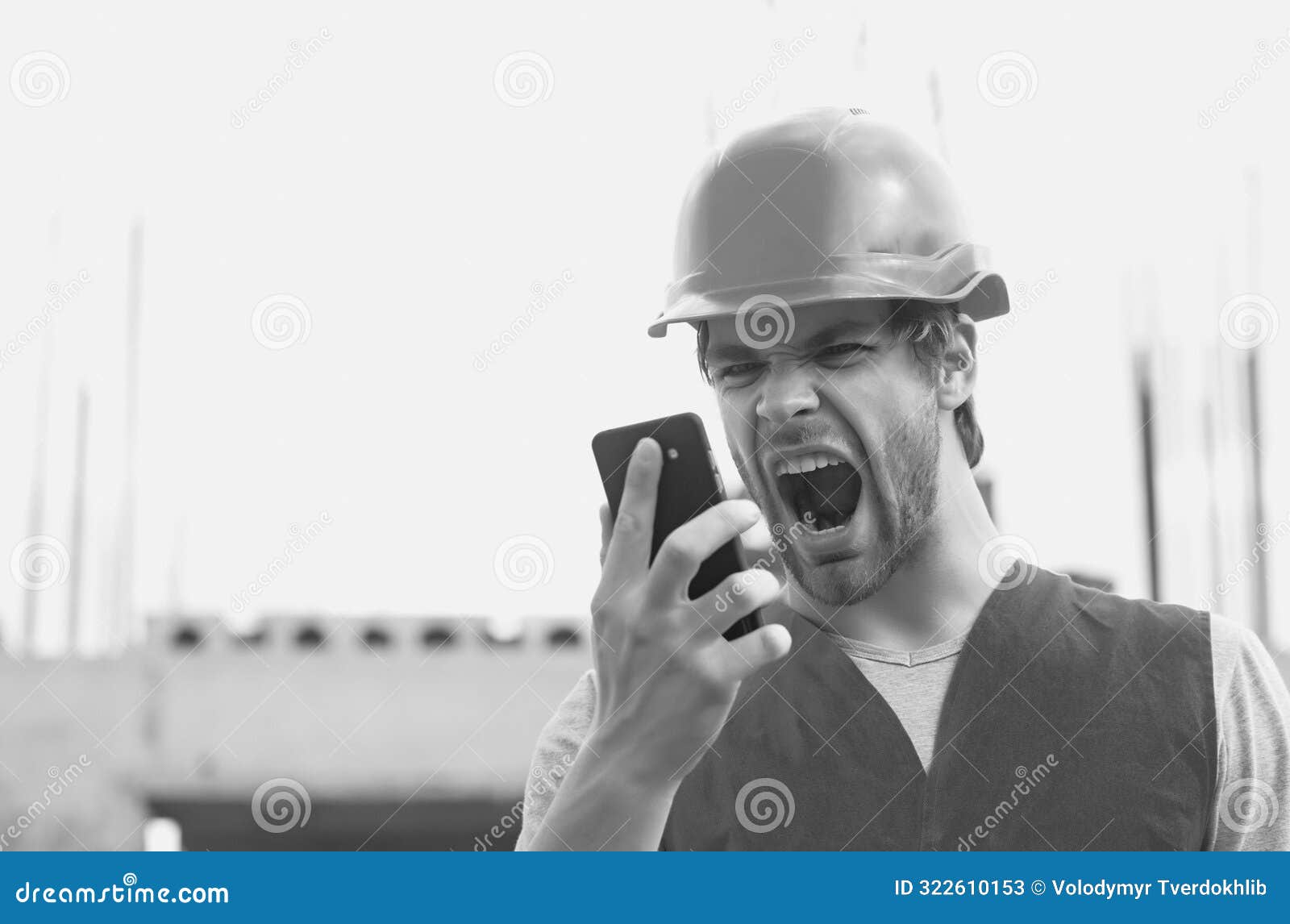 Man Builder Worker in Helmet Screaming in Mobile Phone on Construction ...