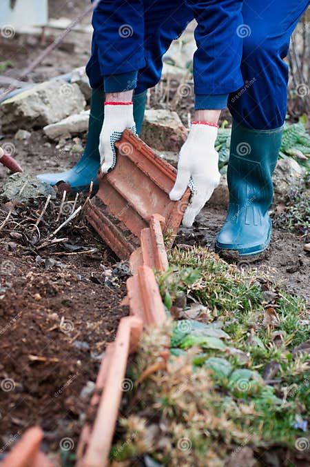 Man building a decor fence stock photo. Image of correction - 28821100