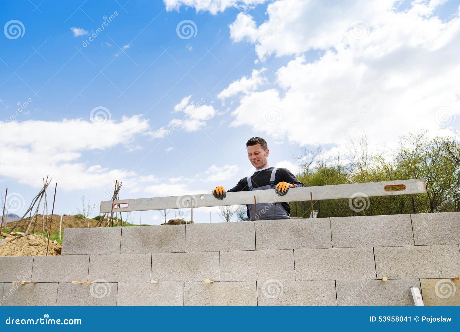 Man building a house stock image. Image of cement, level - 53958041