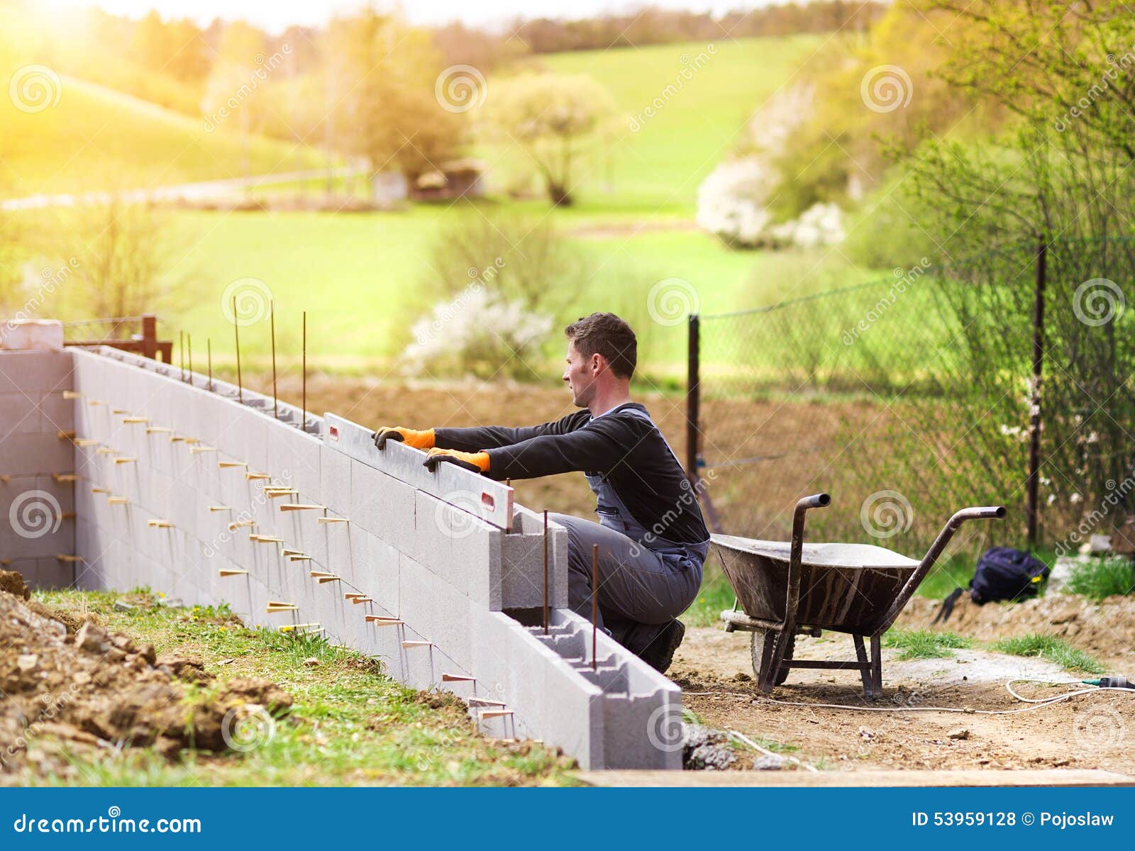 Man building a house stock photo. Image of cement, sunlight - 53959128
