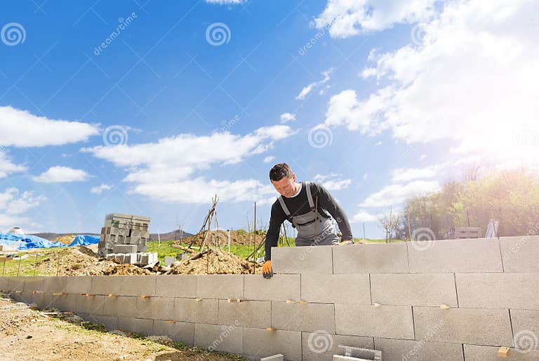 Man building a house stock image. Image of site, construction - 53956355