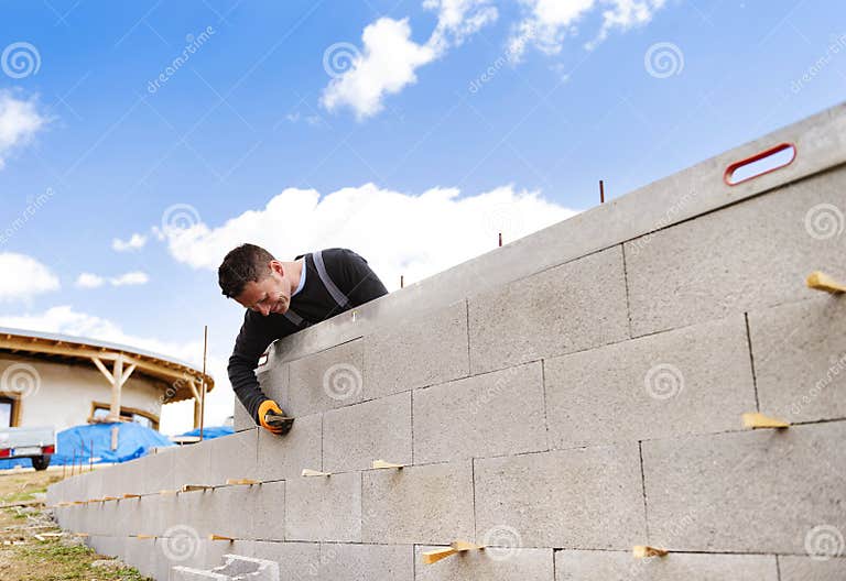 Man building a house stock image. Image of house, bricklayer - 53956503