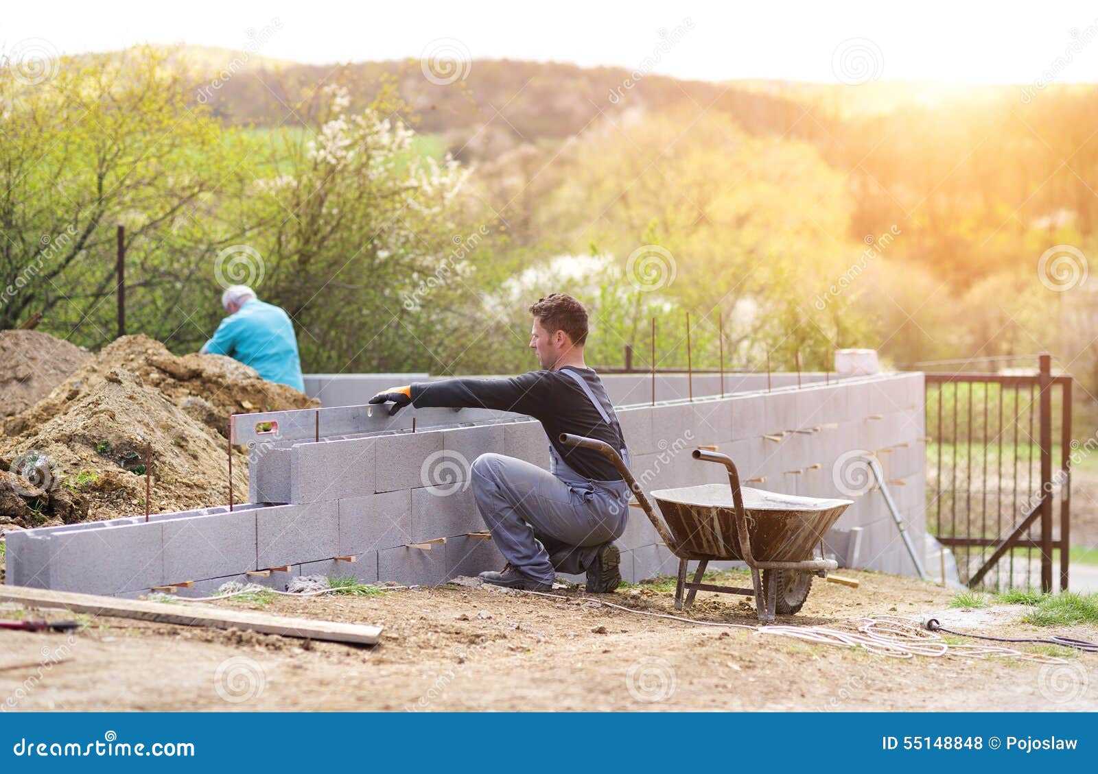 Man building a house stock photo. Image of gloves, mason - 55148848