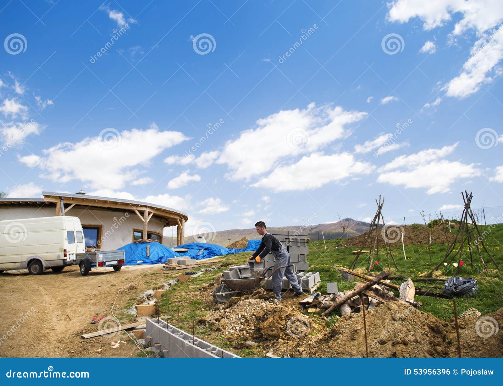 Man building a house stock photo. Image of brick, concrete - 53956396