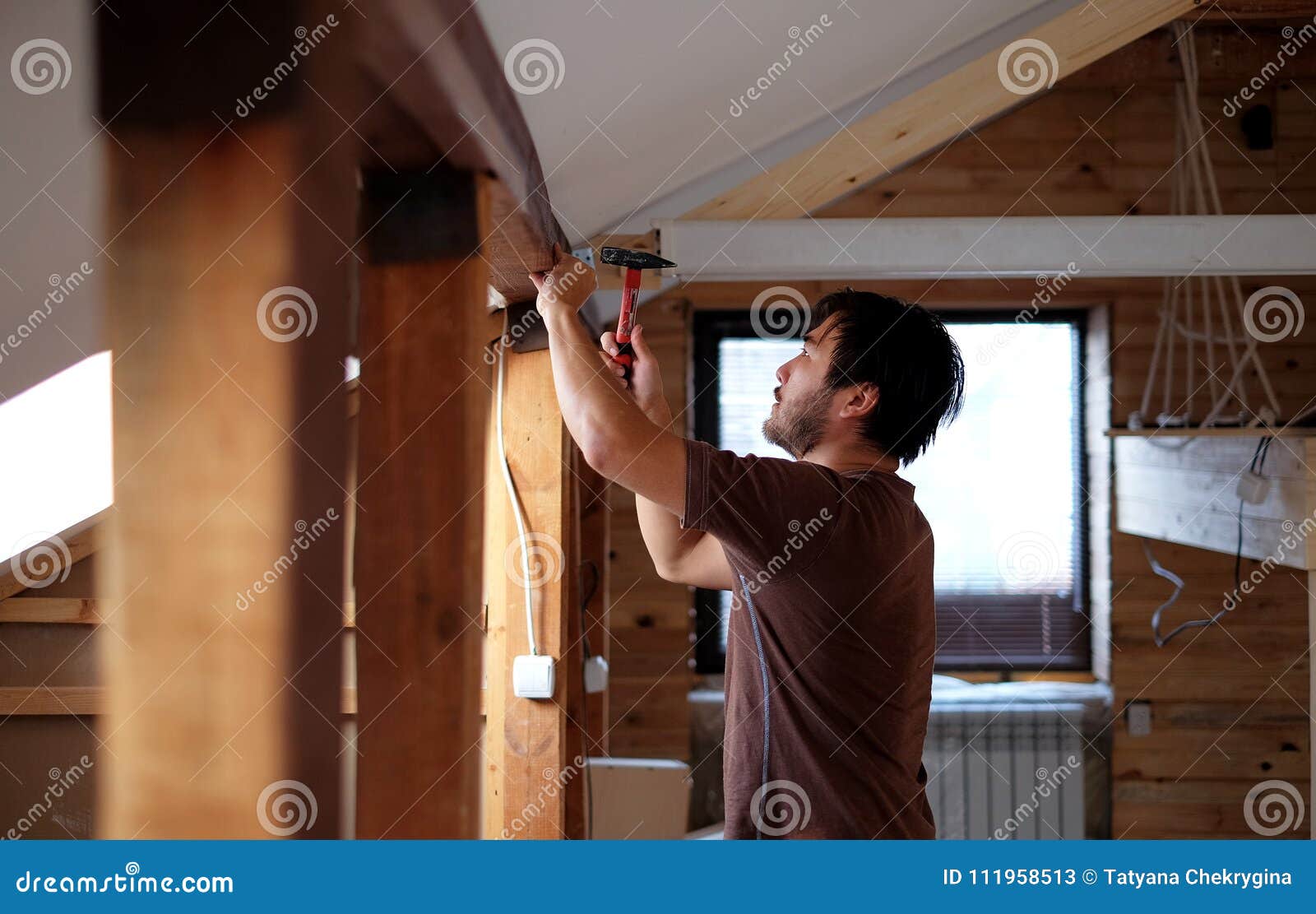 Man Building a House and Workimg with Hammer and Wood Stock Image ...