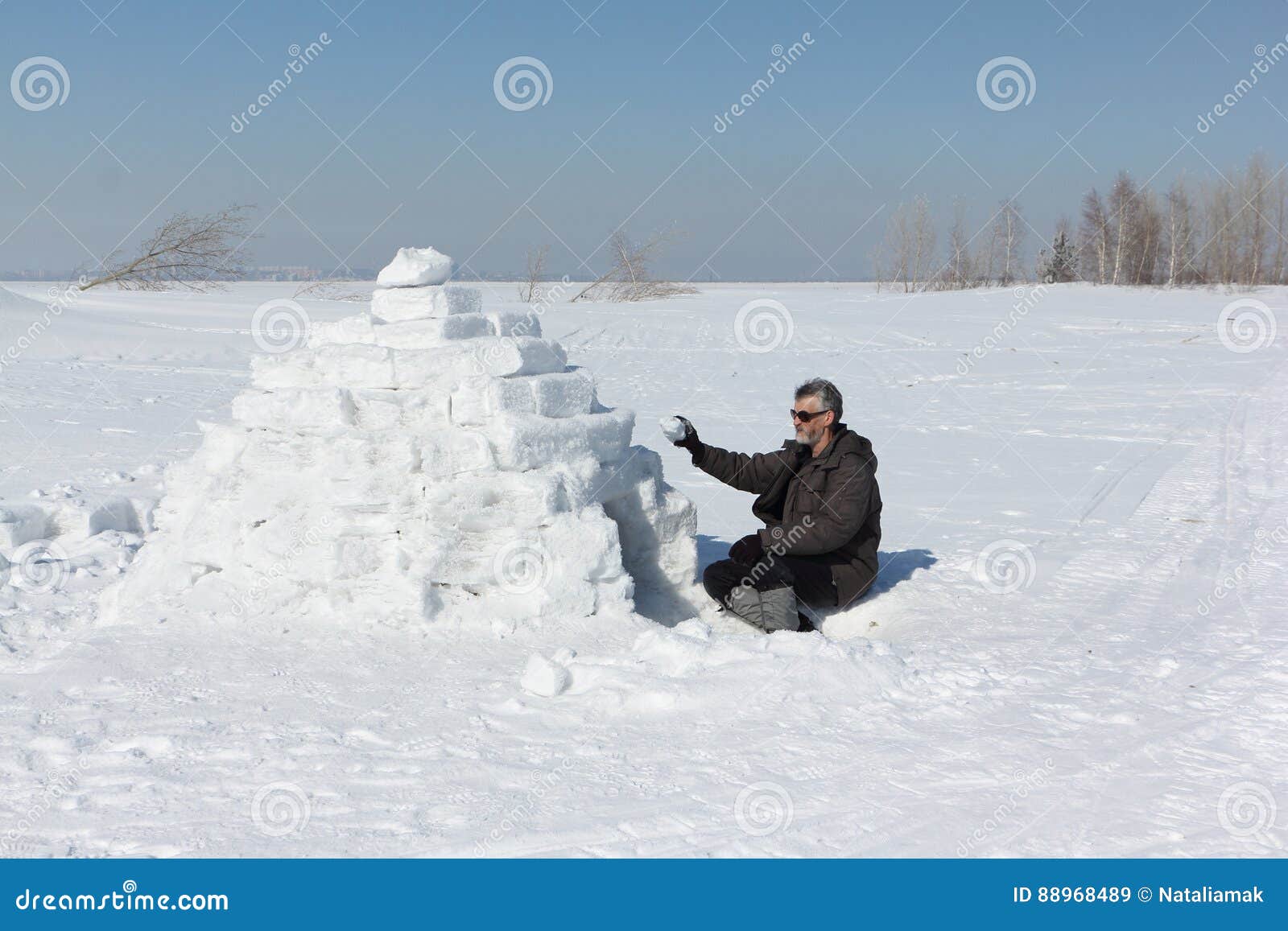 Man Building an Igloo on a Glade Stock Image - Image of dwelling ...