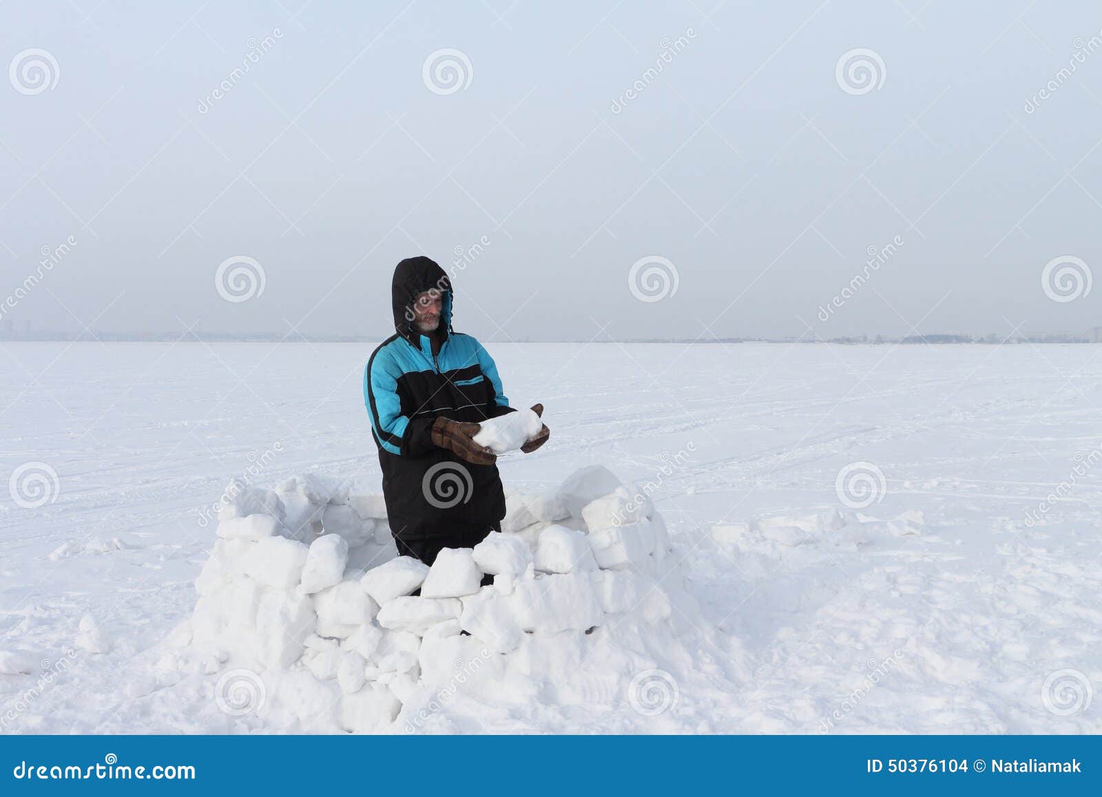 The man building a igloo stock photo. Image of nature - 50376104
