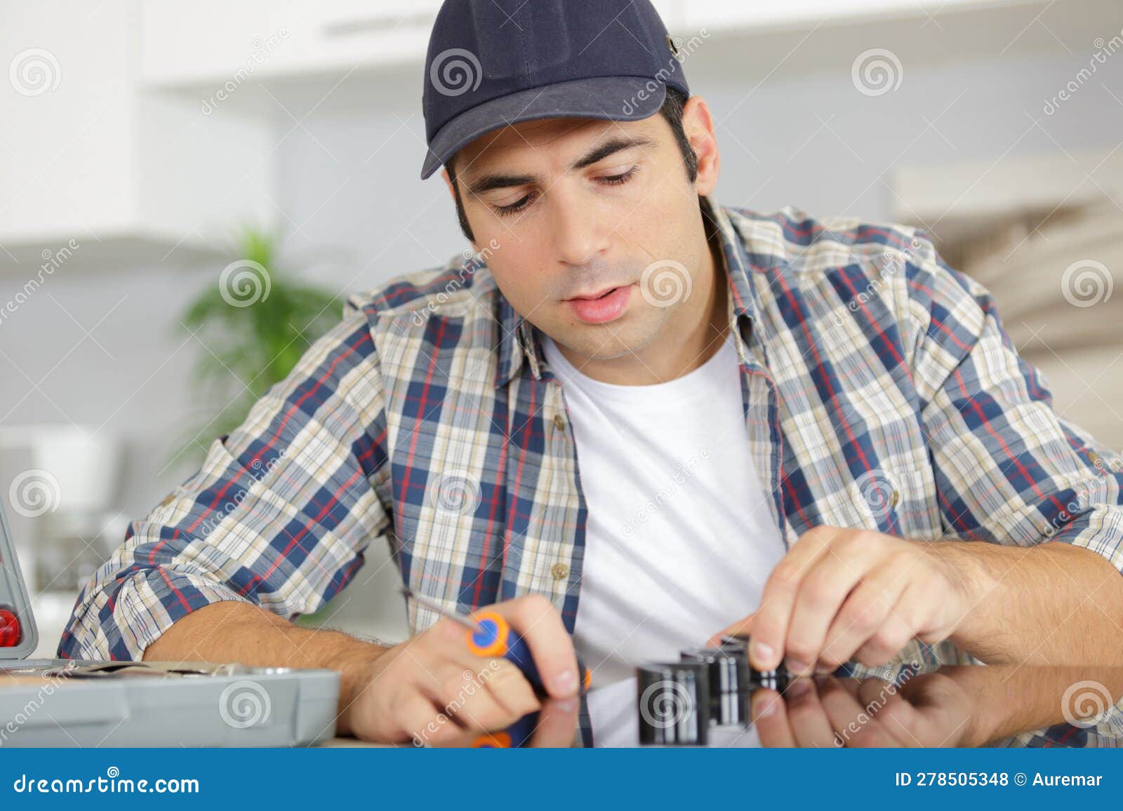 Man building kitchen stock photo. Image of worktool - 278505348