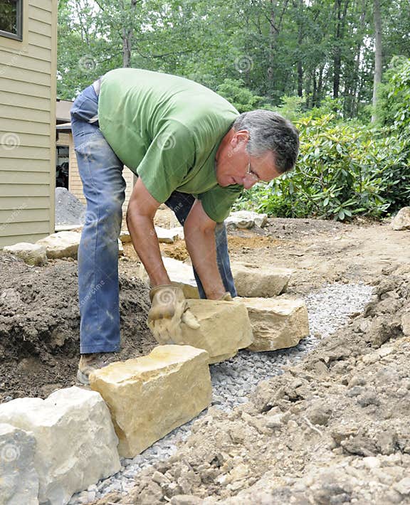 Man building stone wall stock image. Image of skill, worker - 17735247