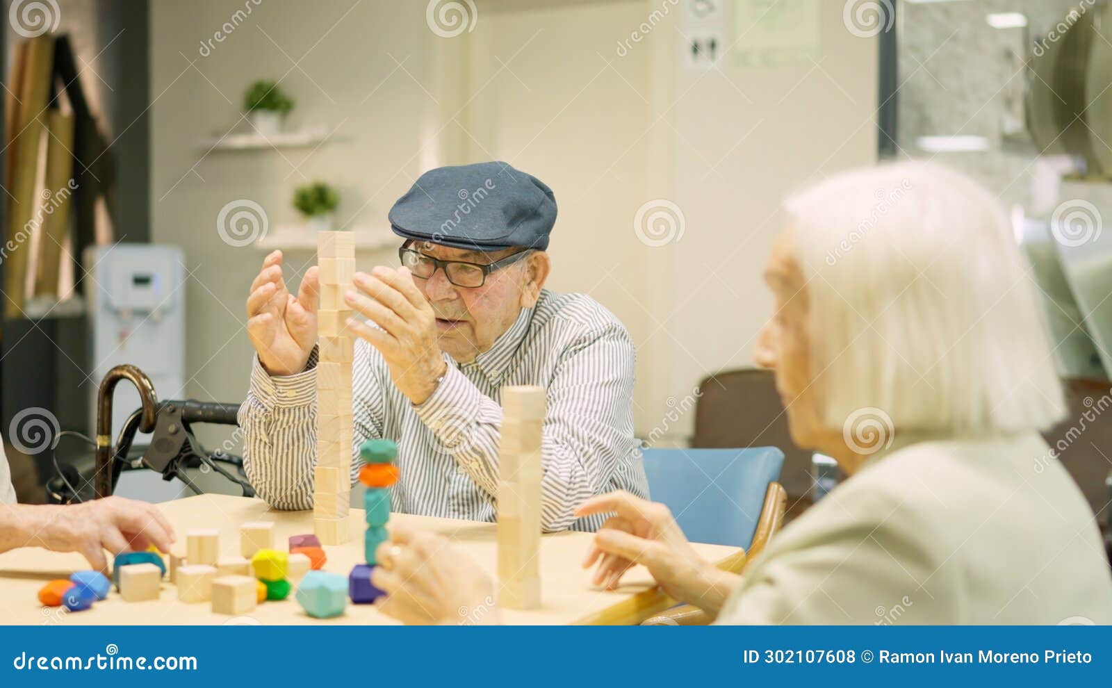 Man Building a Tower As Skill Games in a Geriatric Stock Photo - Image ...