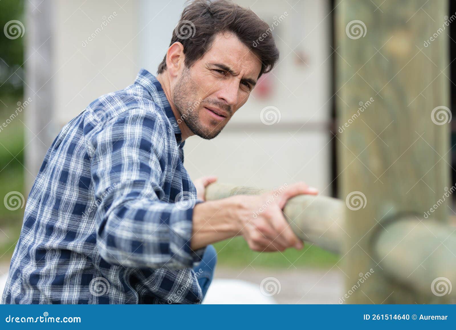 Man Building Wooden Fence in Backyard Stock Photo - Image of backyard ...