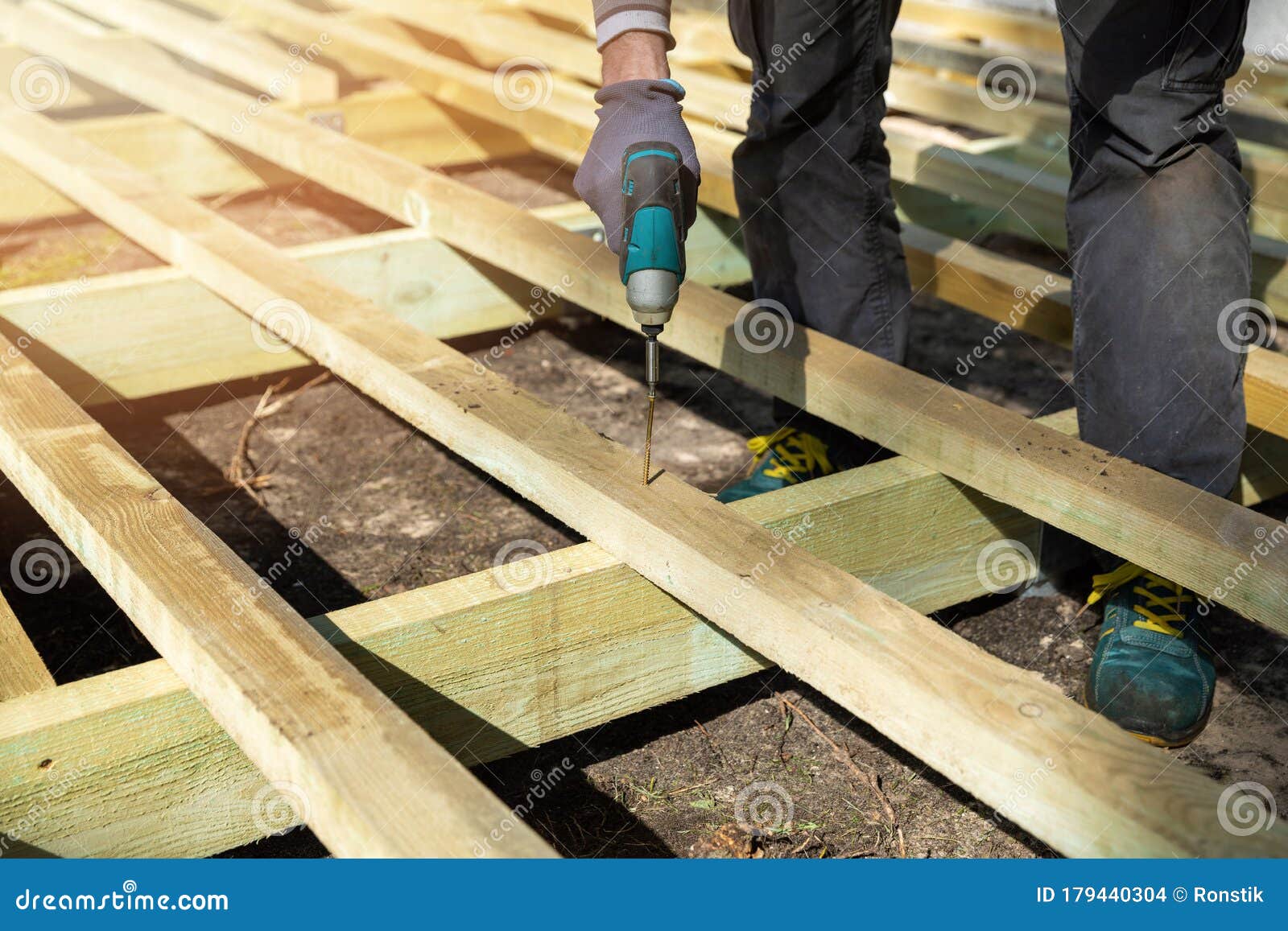 Man Building Wooden Frame for Patio Deck Stock Photo - Image of ...