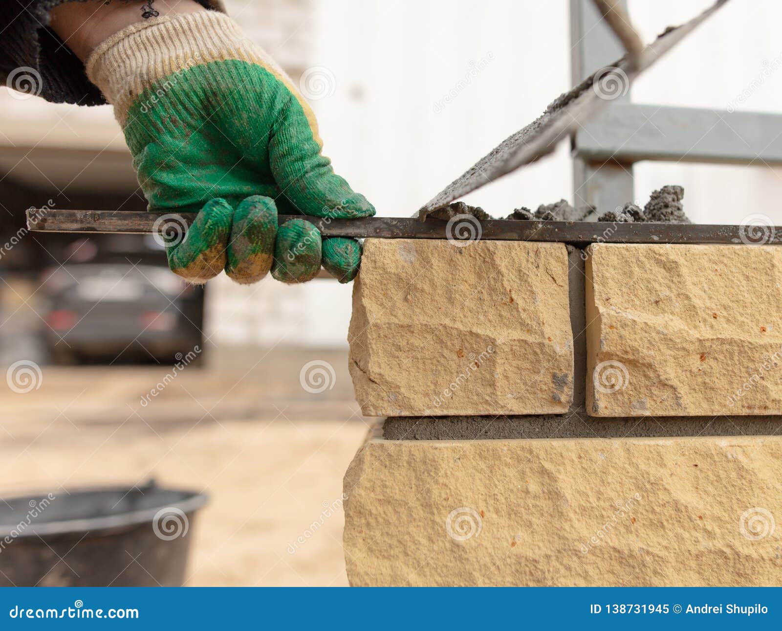 Man Builds a Brick Wall at a Construction Site Stock Image - Image of ...