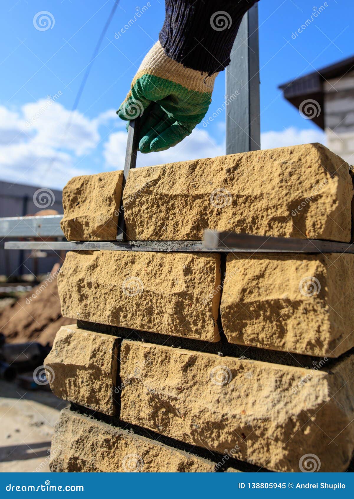 Man Builds a Brick Wall at a Construction Site Stock Image - Image of ...