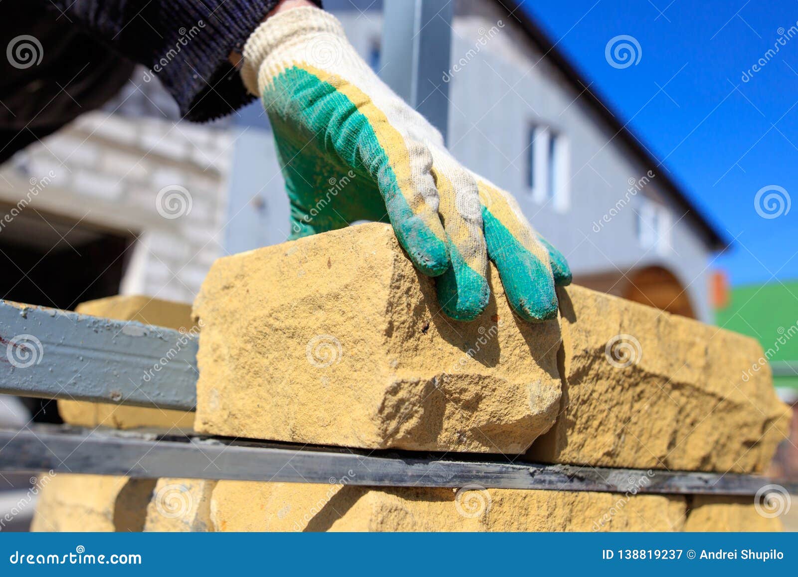 Man Builds a Brick Wall at a Construction Site Stock Image - Image of ...